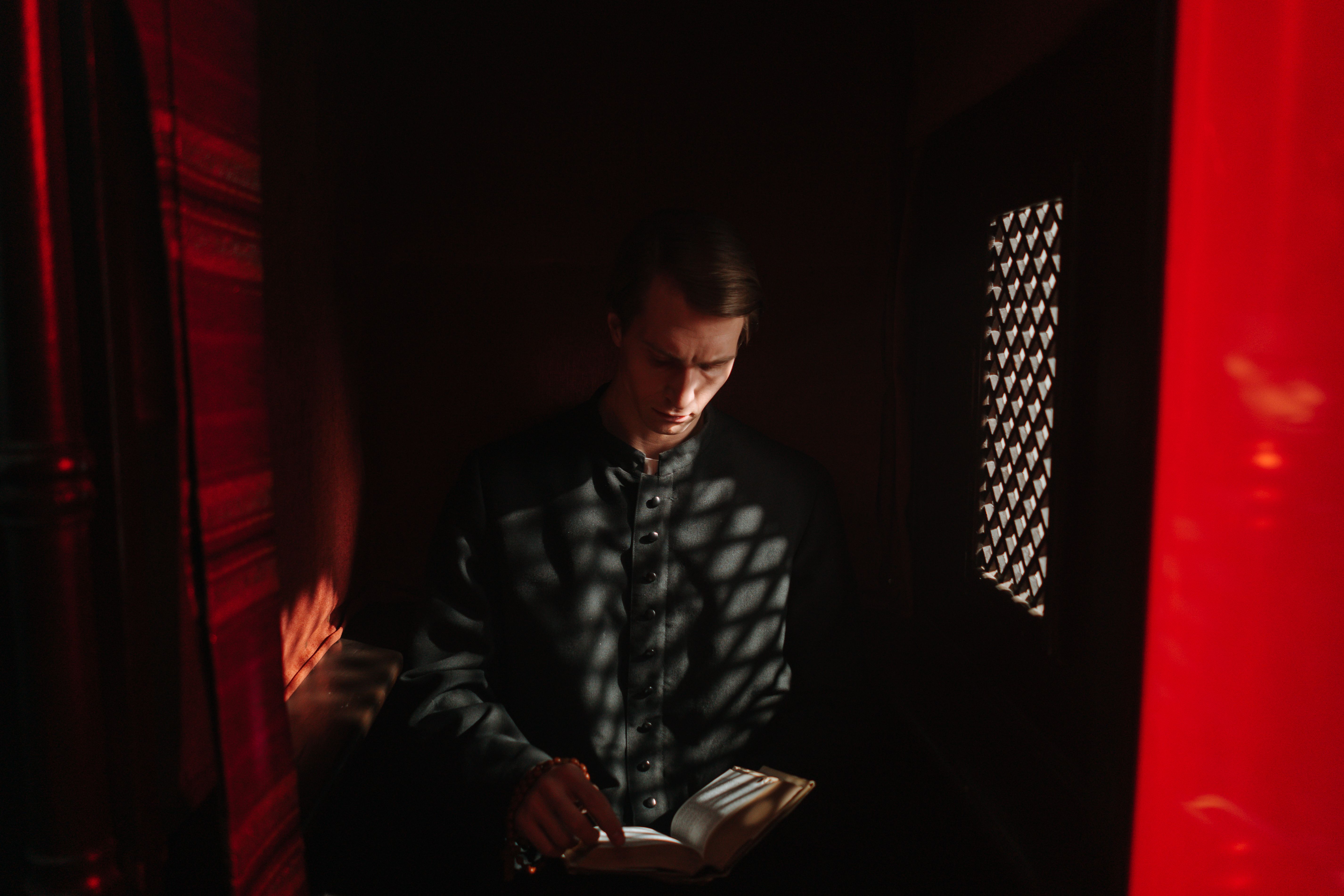 Priest reading a Bible · Free Stock Photo