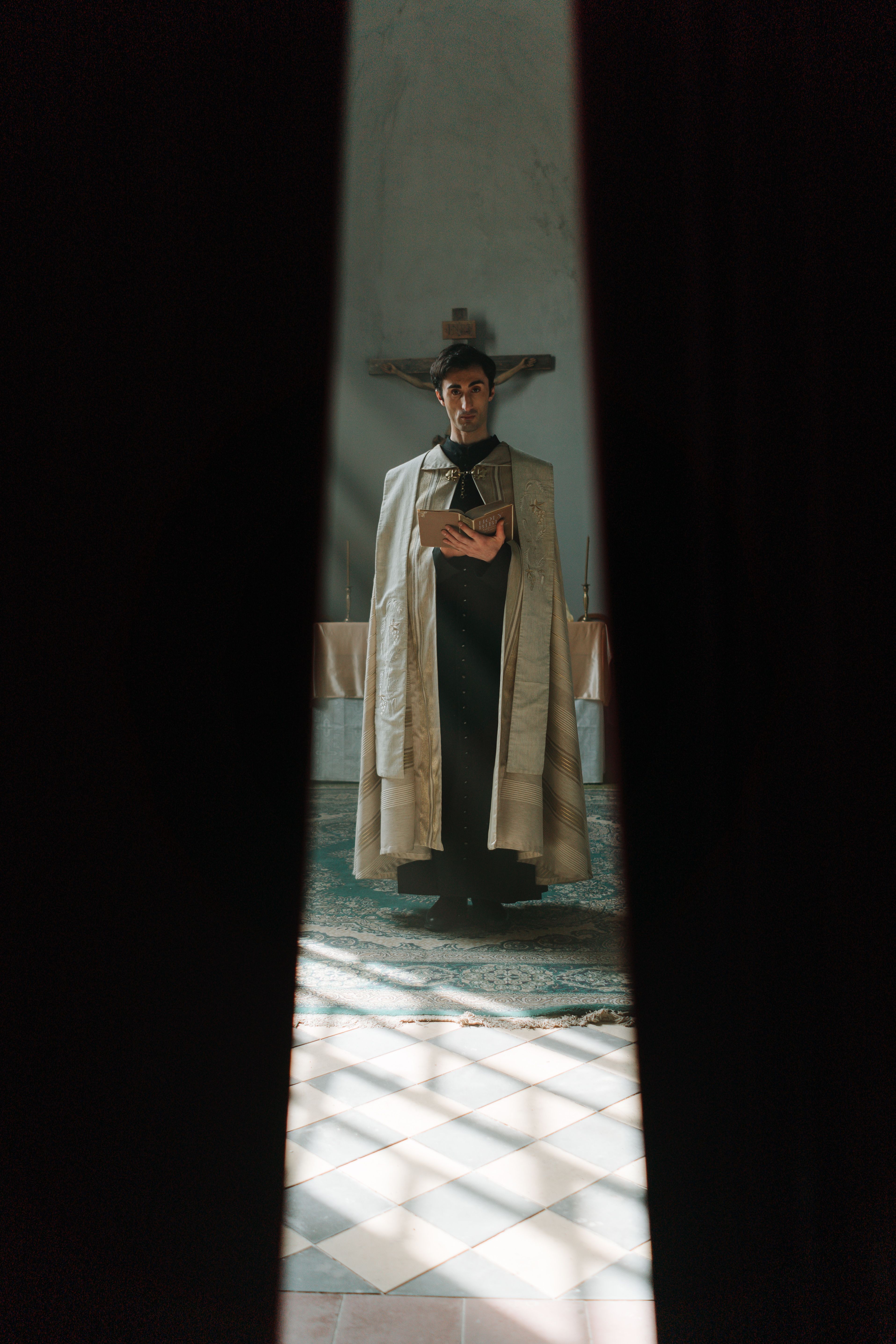 A Priest Preaching a Scripture from the Bible · Free Stock Photo