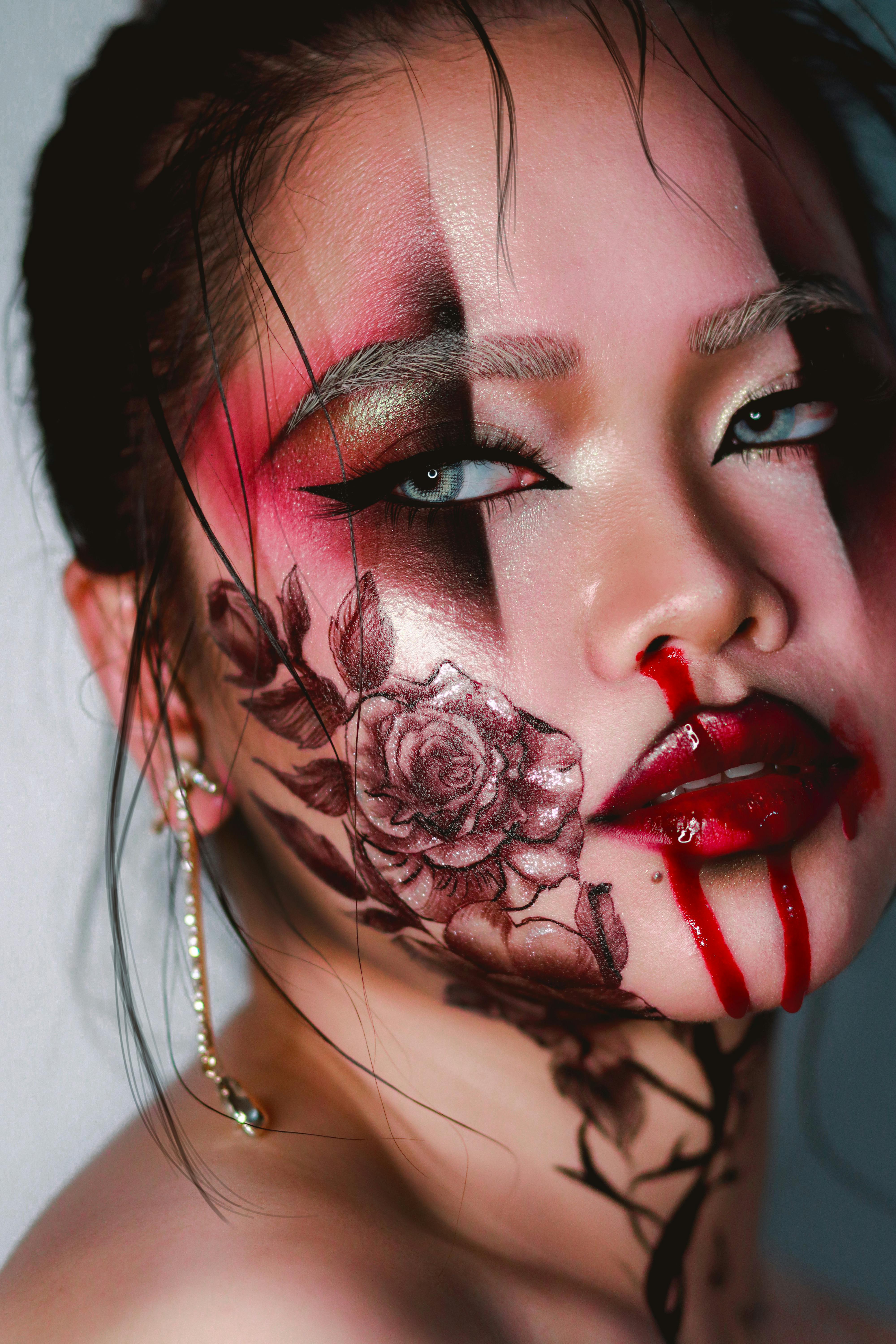 A Woman with Creative Makeup on Her Face · Free Stock Photo