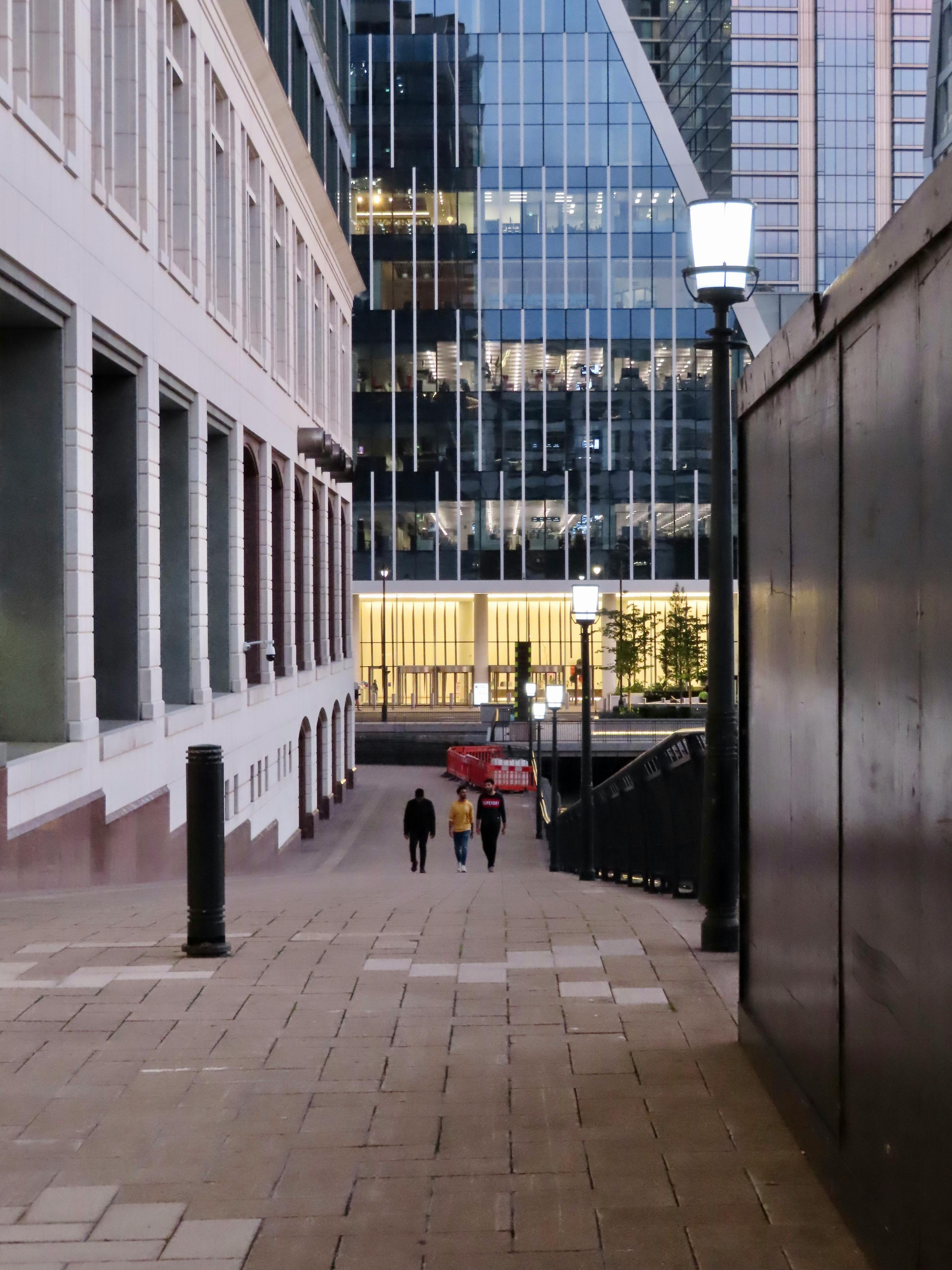 A Side View of a Woman Walking on the Street · Free Stock Photo