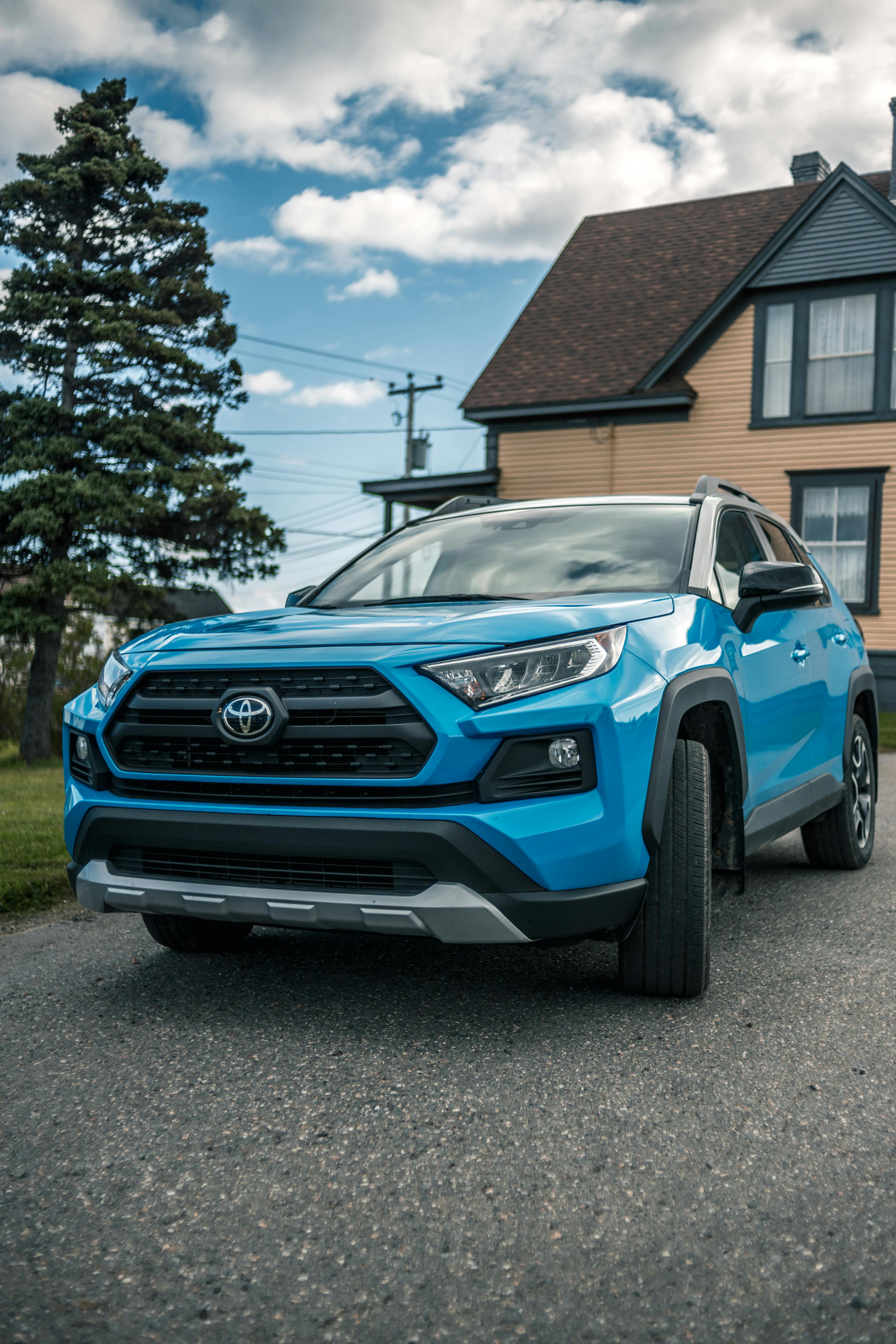 A Blue Car Parked on the Street · Free Stock Photo