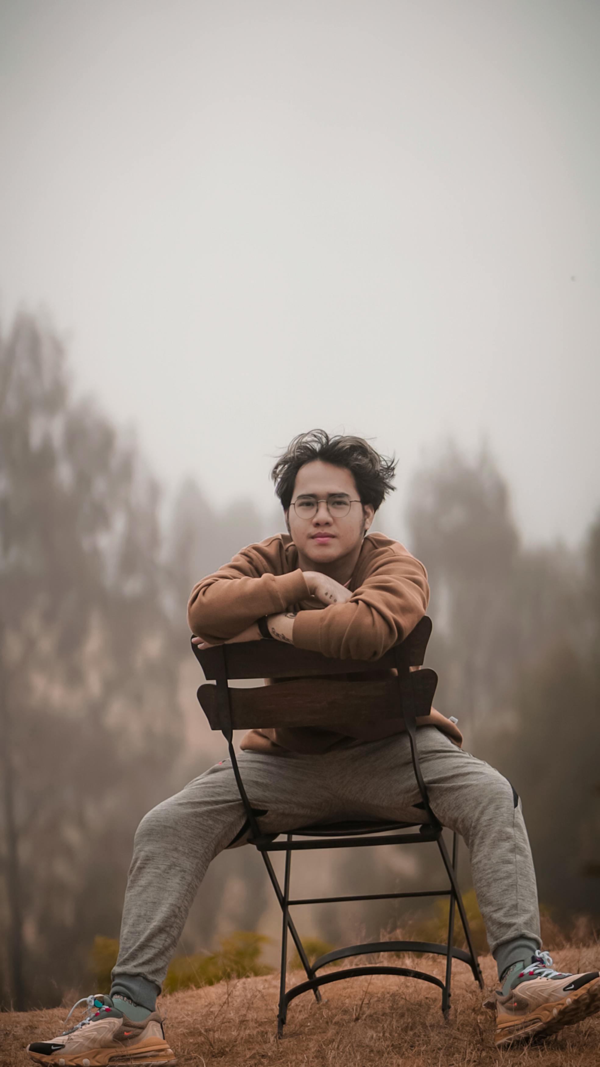 Man Sitting on Algida Red Chair · Free Stock Photo