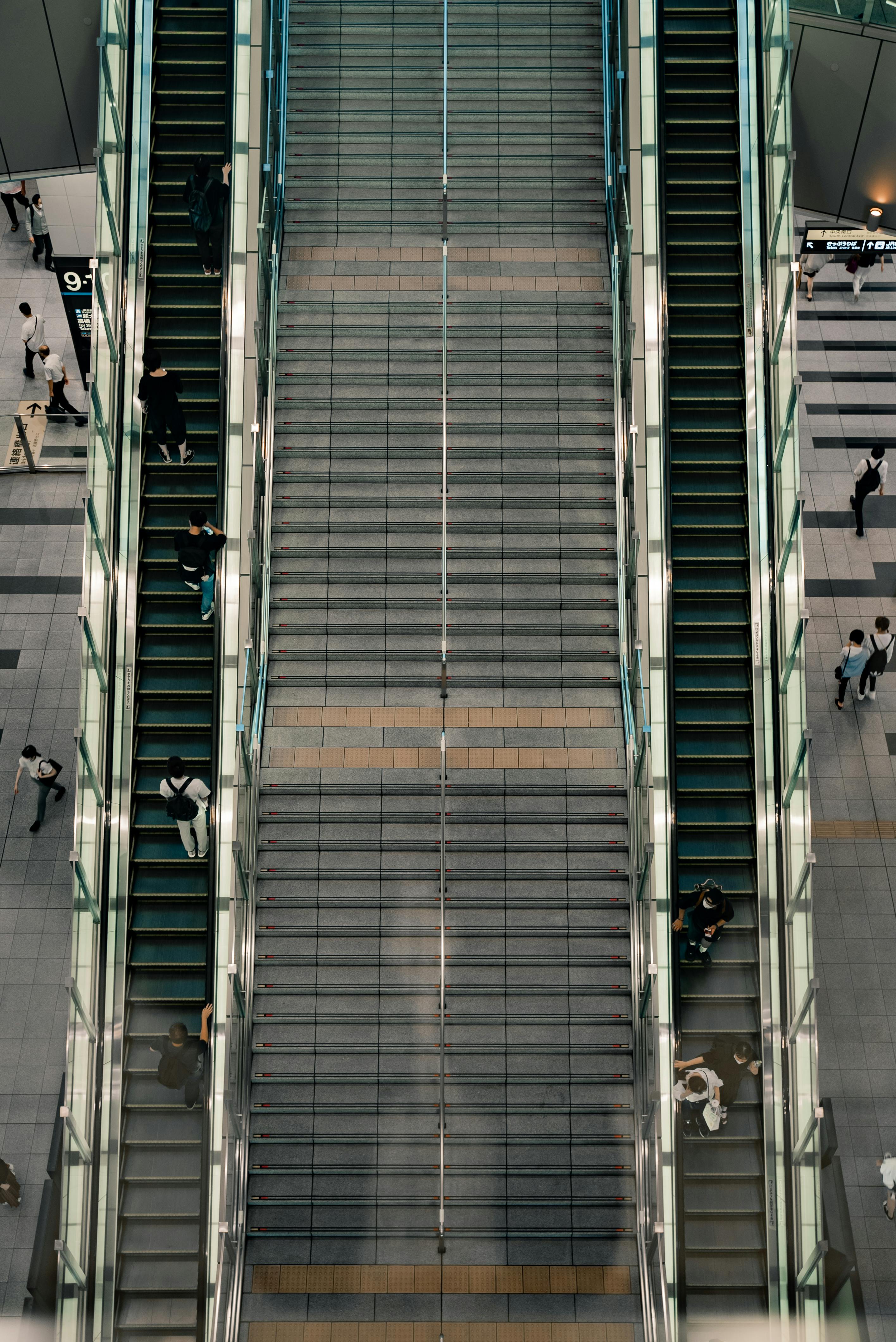 Aerial View of People on the Escalator · Free Stock Photo