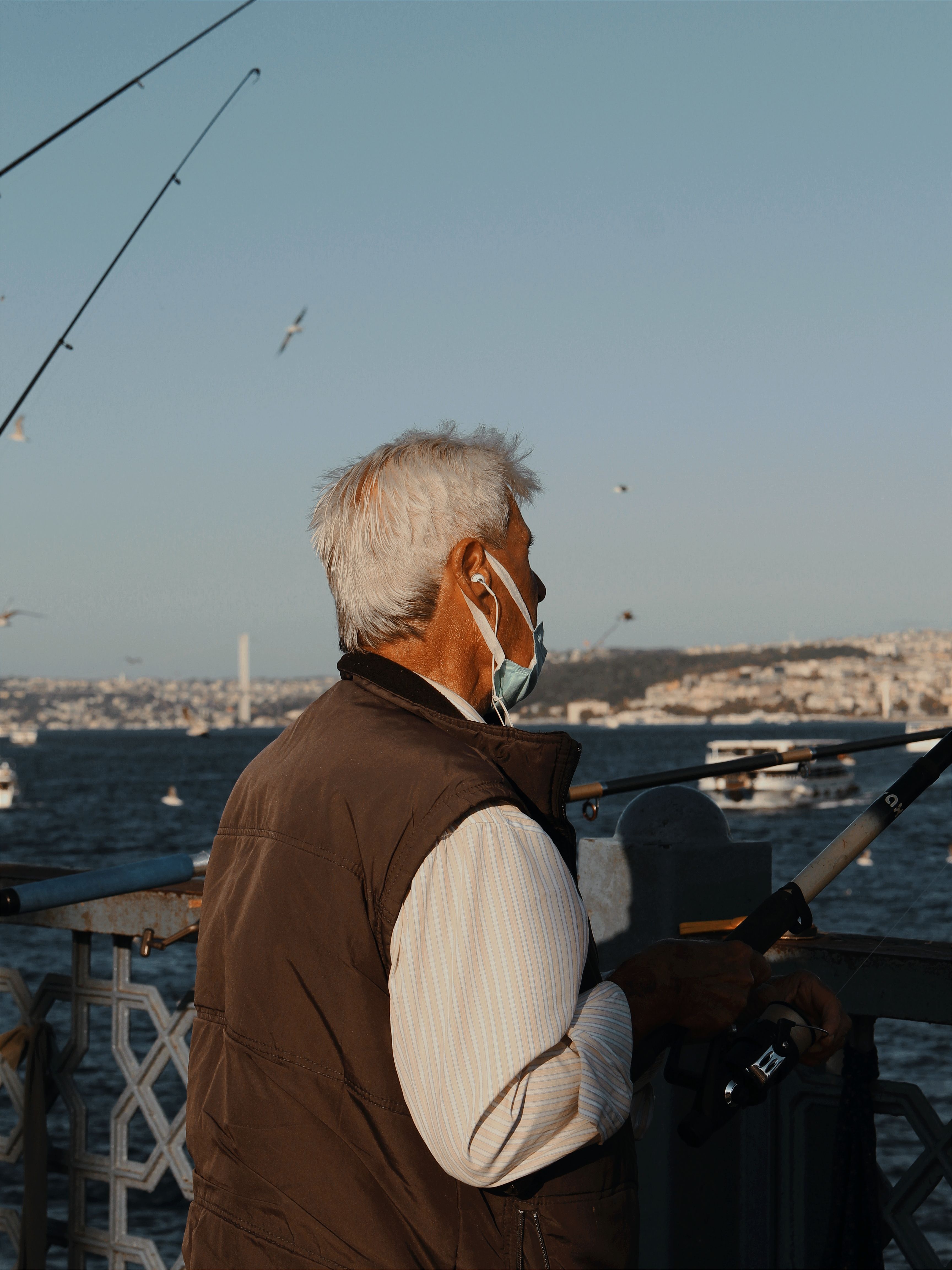 Man Wearing Face Mask Fishing · Free Stock Photo