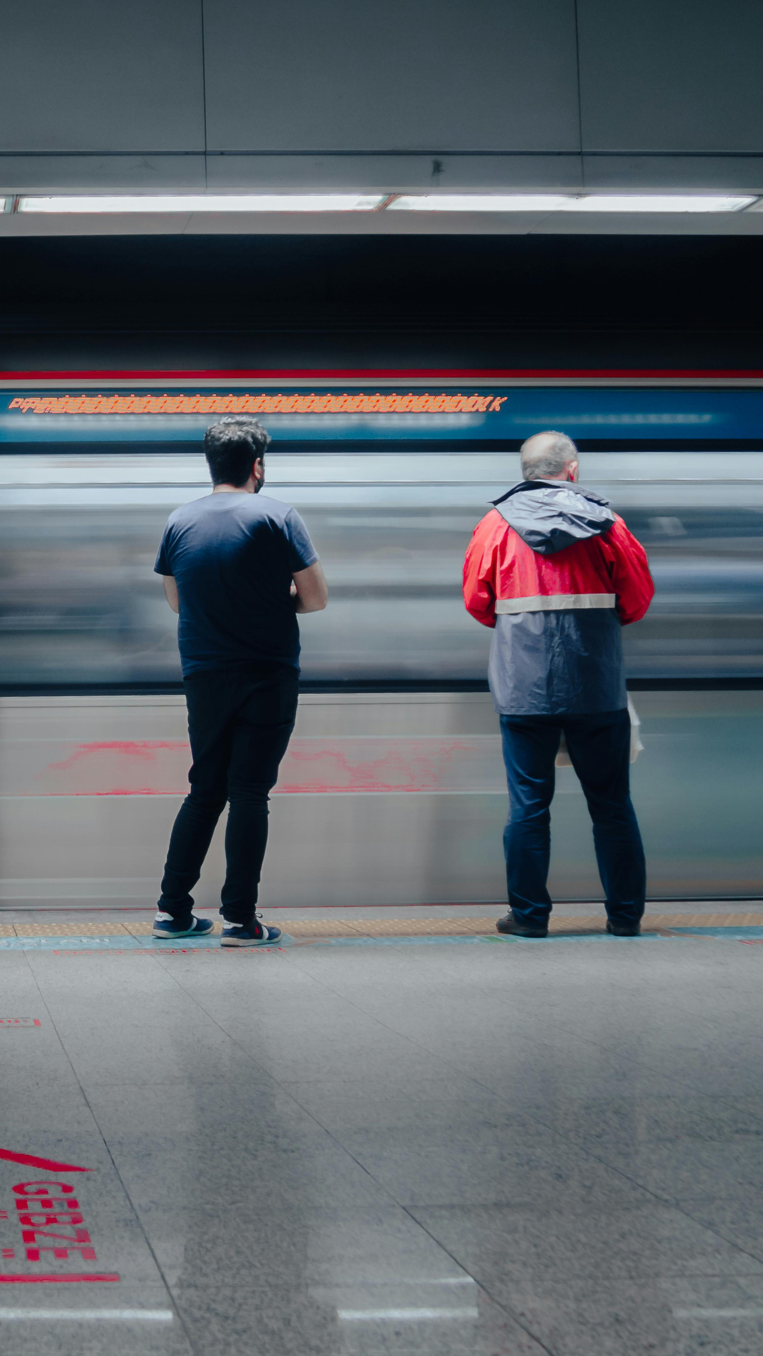 Men Standing on Train Station · Free Stock Photo