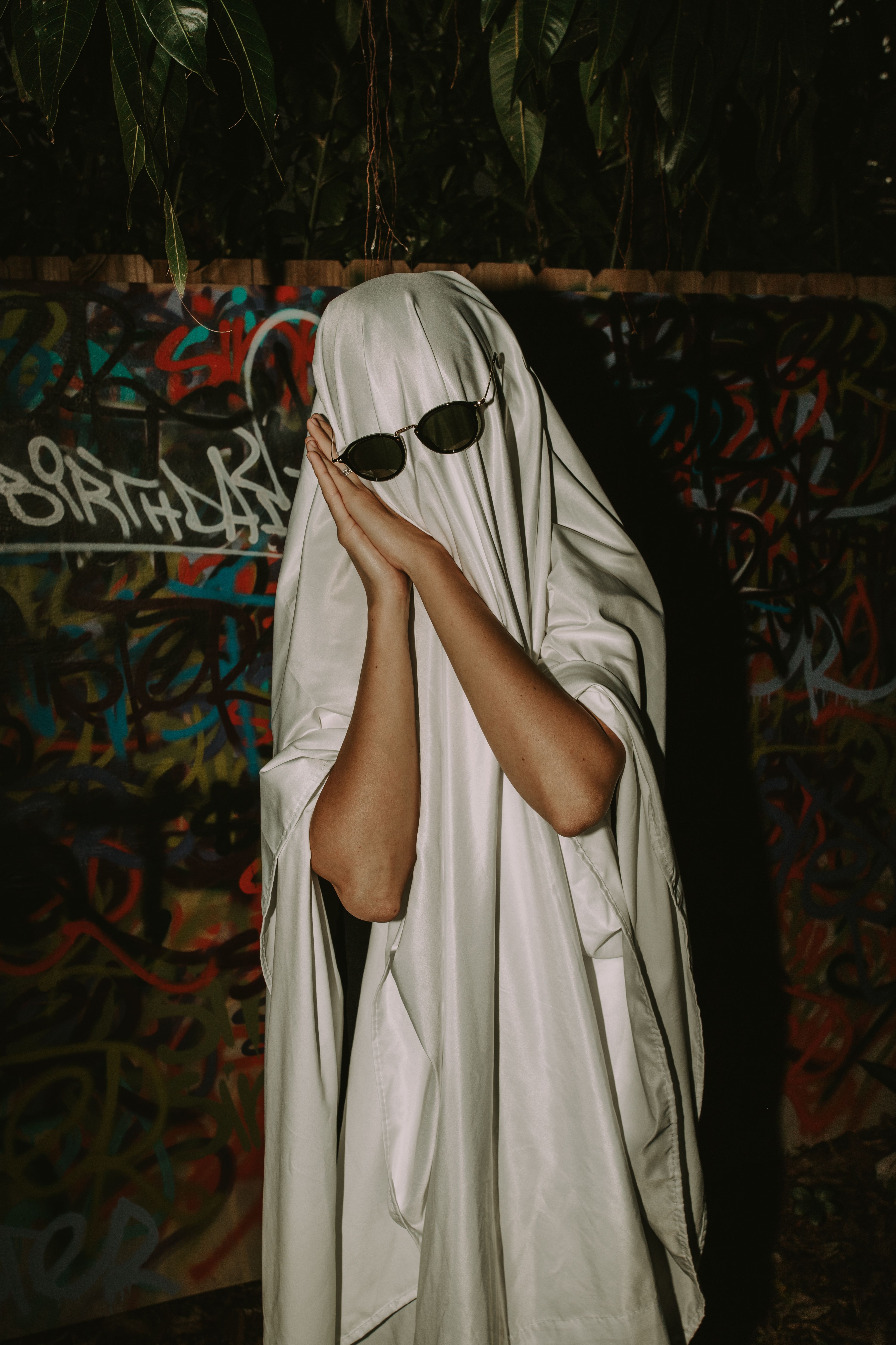 People in White Sheets Dressed as Ghosts · Free Stock Photo