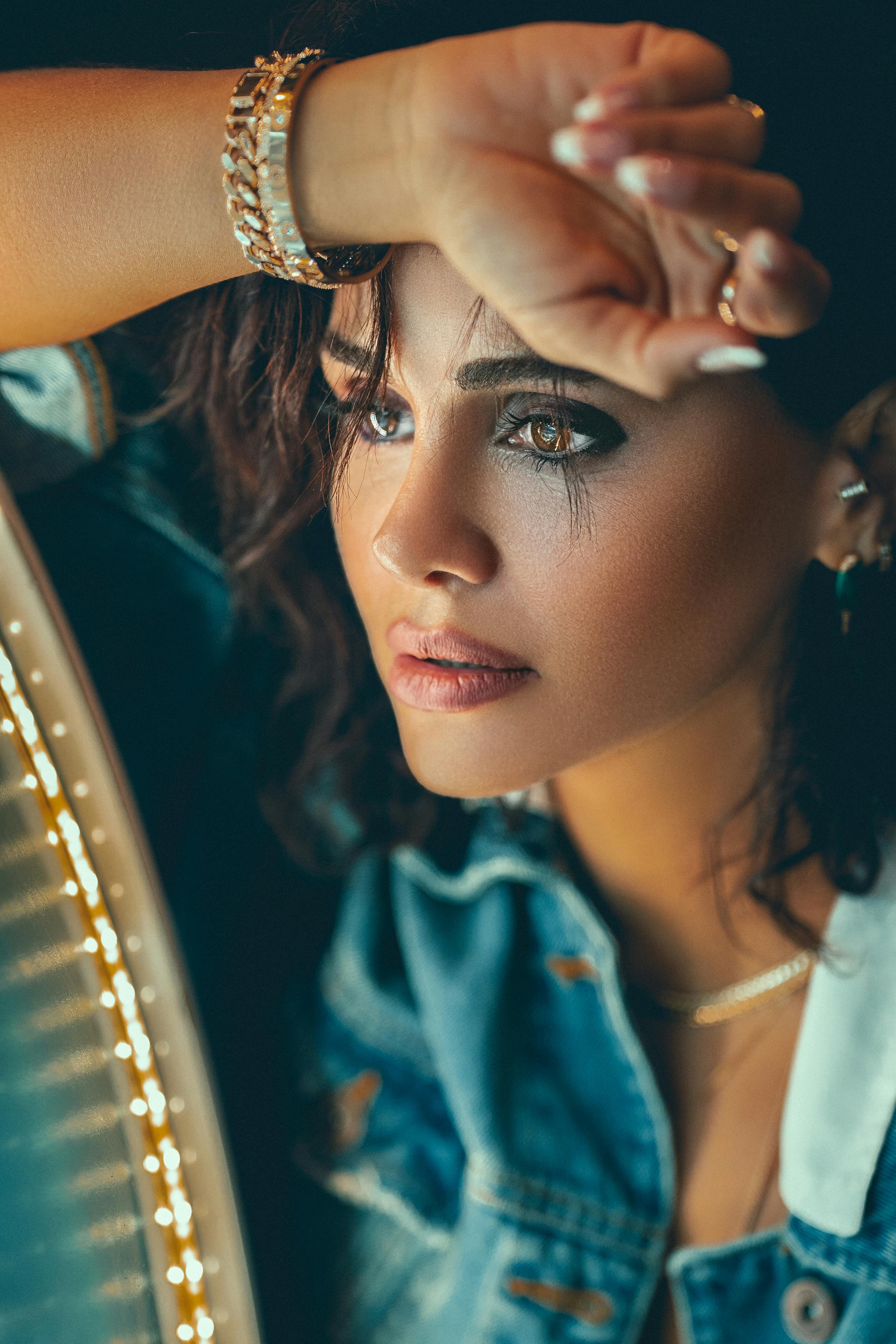 Woman Resting Forehead on her Arm · Free Stock Photo