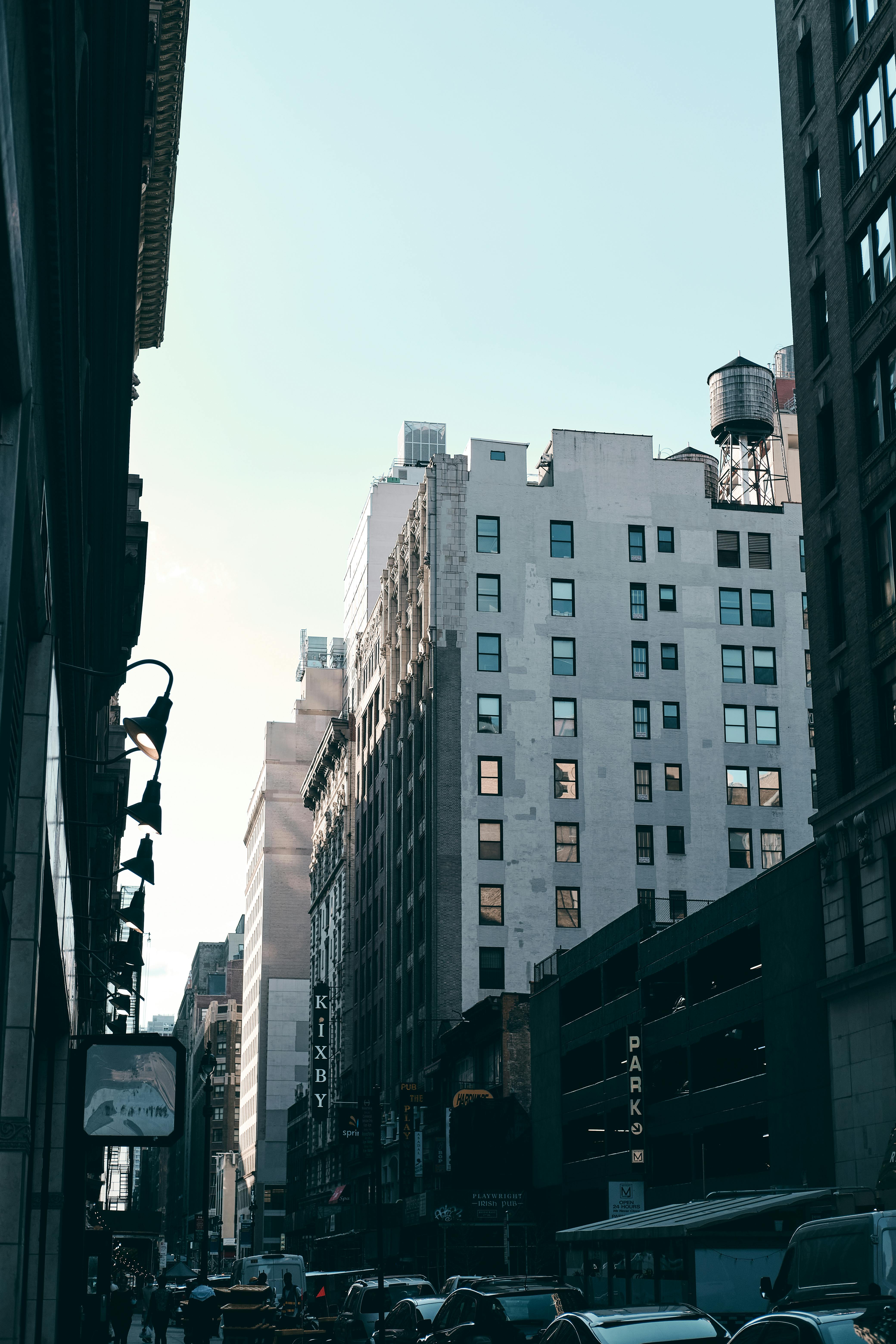 City Street with Modern Buildings and Car Traffic · Free Stock Photo