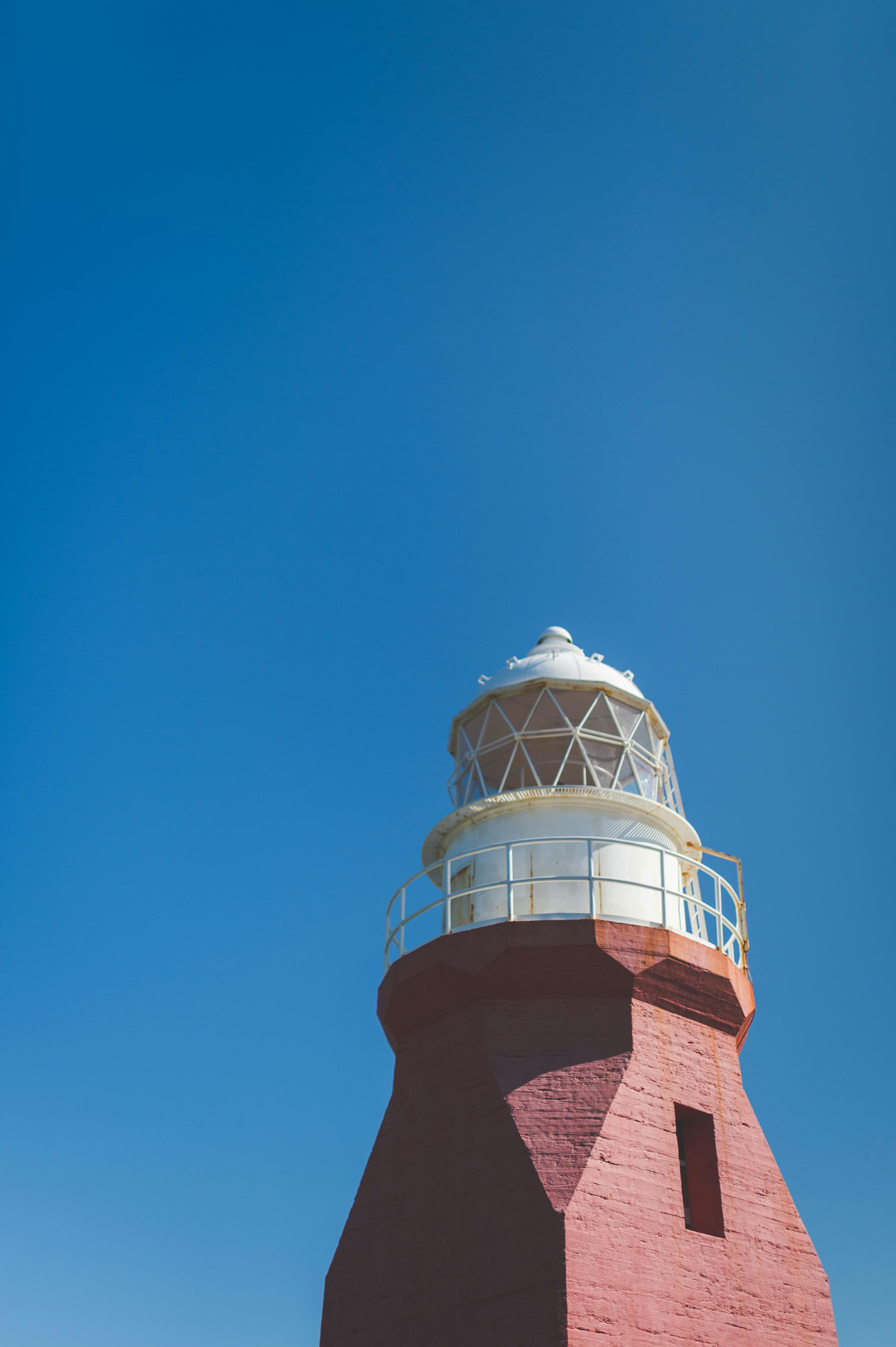 White Lighthouse Under Blue Sky · Free Stock Photo
