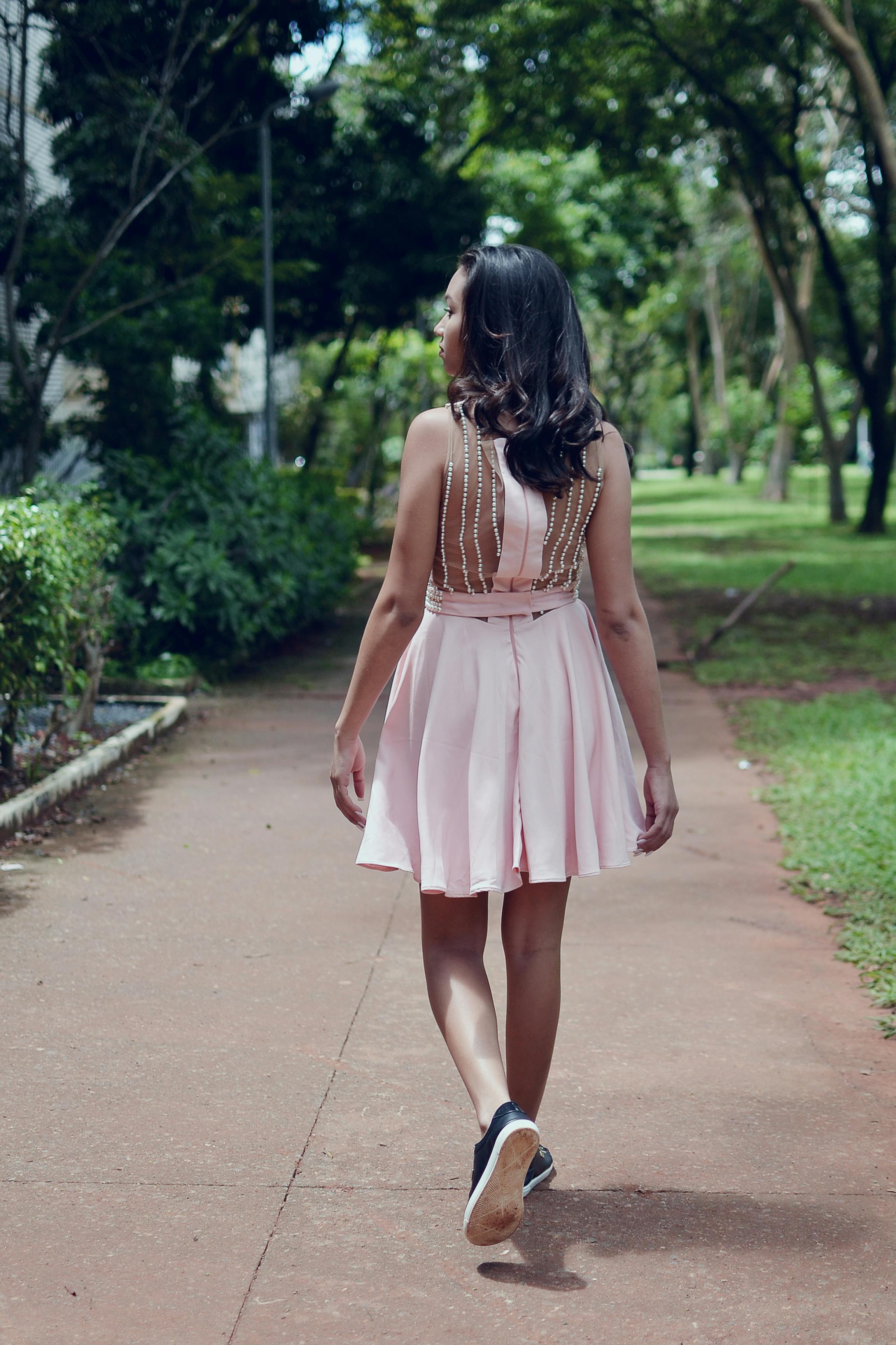 Woman Wearing Pink Mini Dress Walking on Walkway · Free Stock Photo