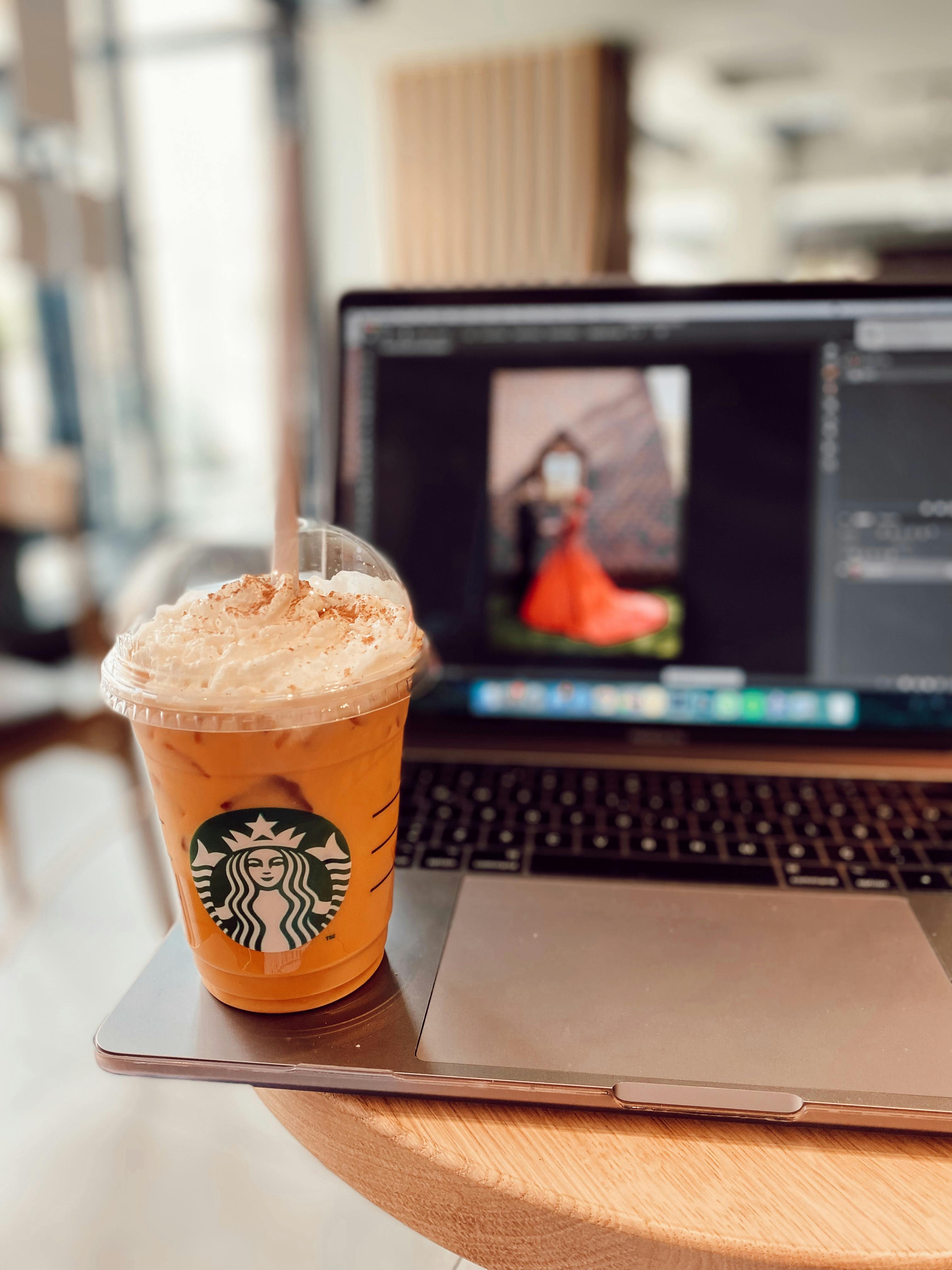 Macbook Pro Besides Clear Glass Mug · Free Stock Photo