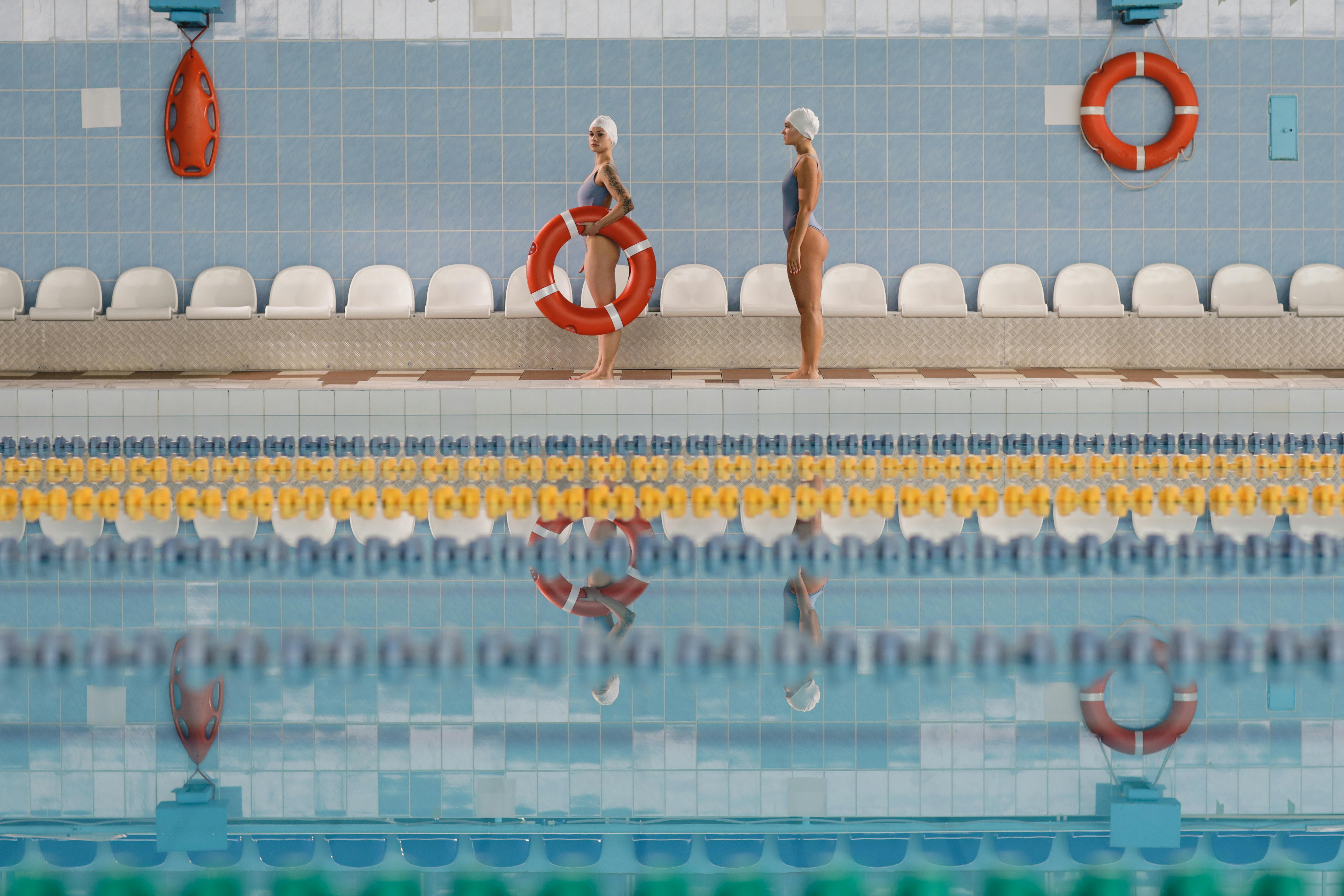 Group of Women Practicing in the Swimming Pool · Free Stock Photo