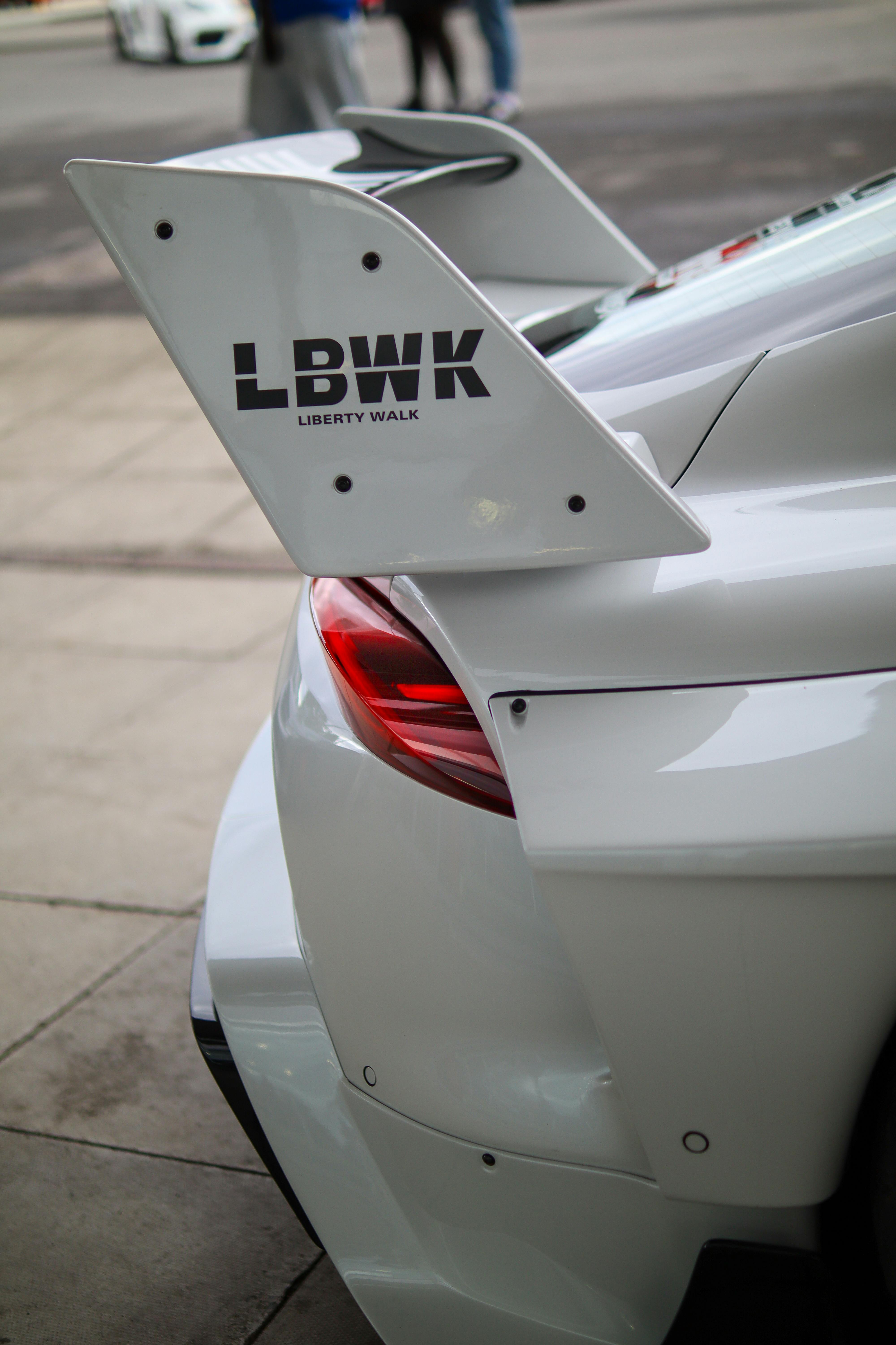 Back View Shot of an Expensive White Car · Free Stock Photo