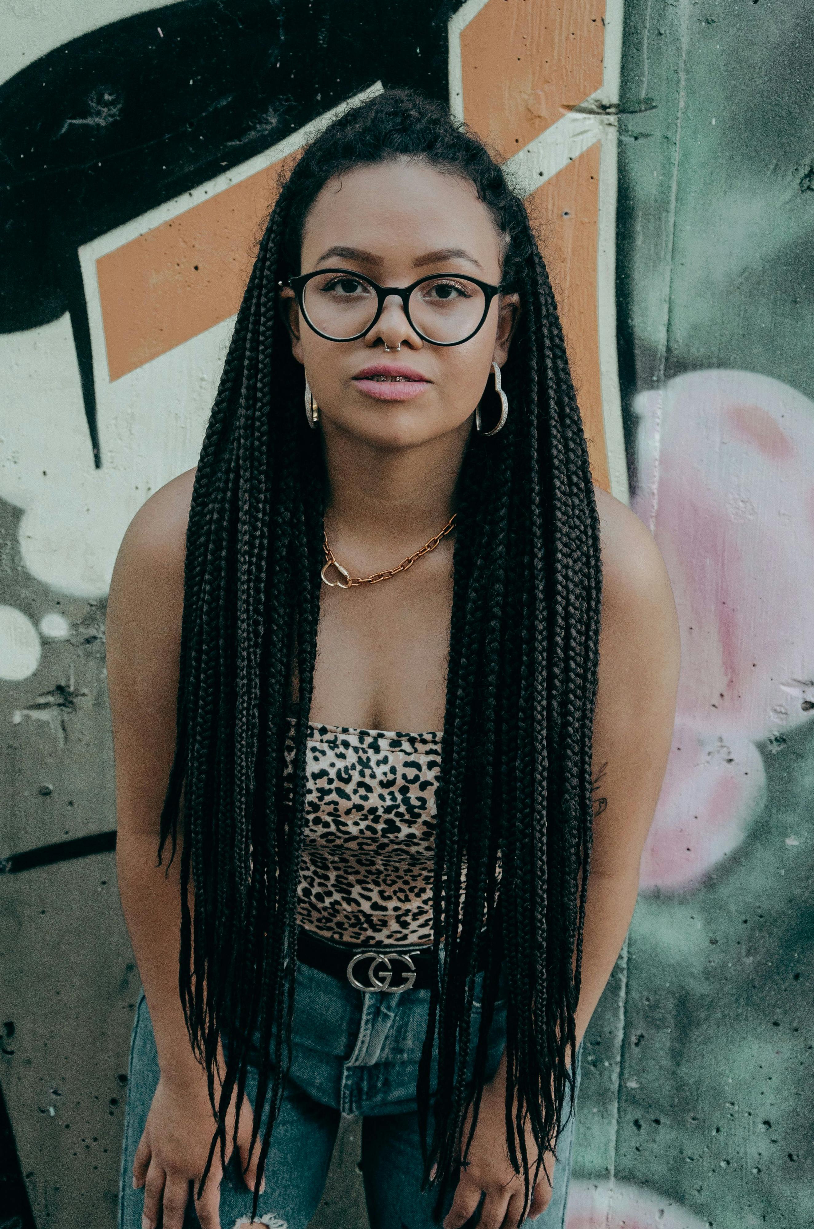 Woman in Black Tank Top Wearing Black Framed Eyeglasses · Free Stock Photo