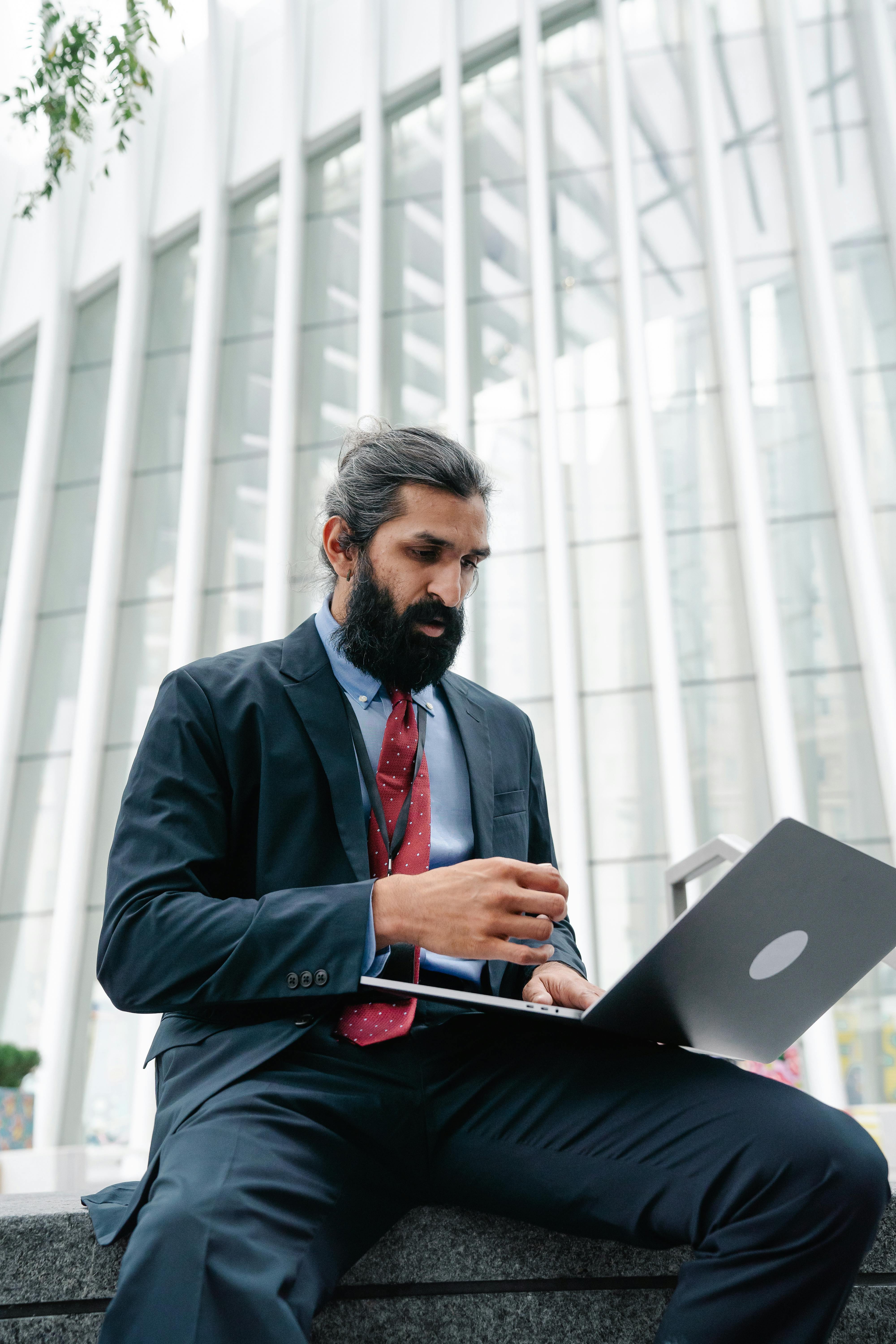 Low Angle Shot of Man using Laptop · Free Stock Photo