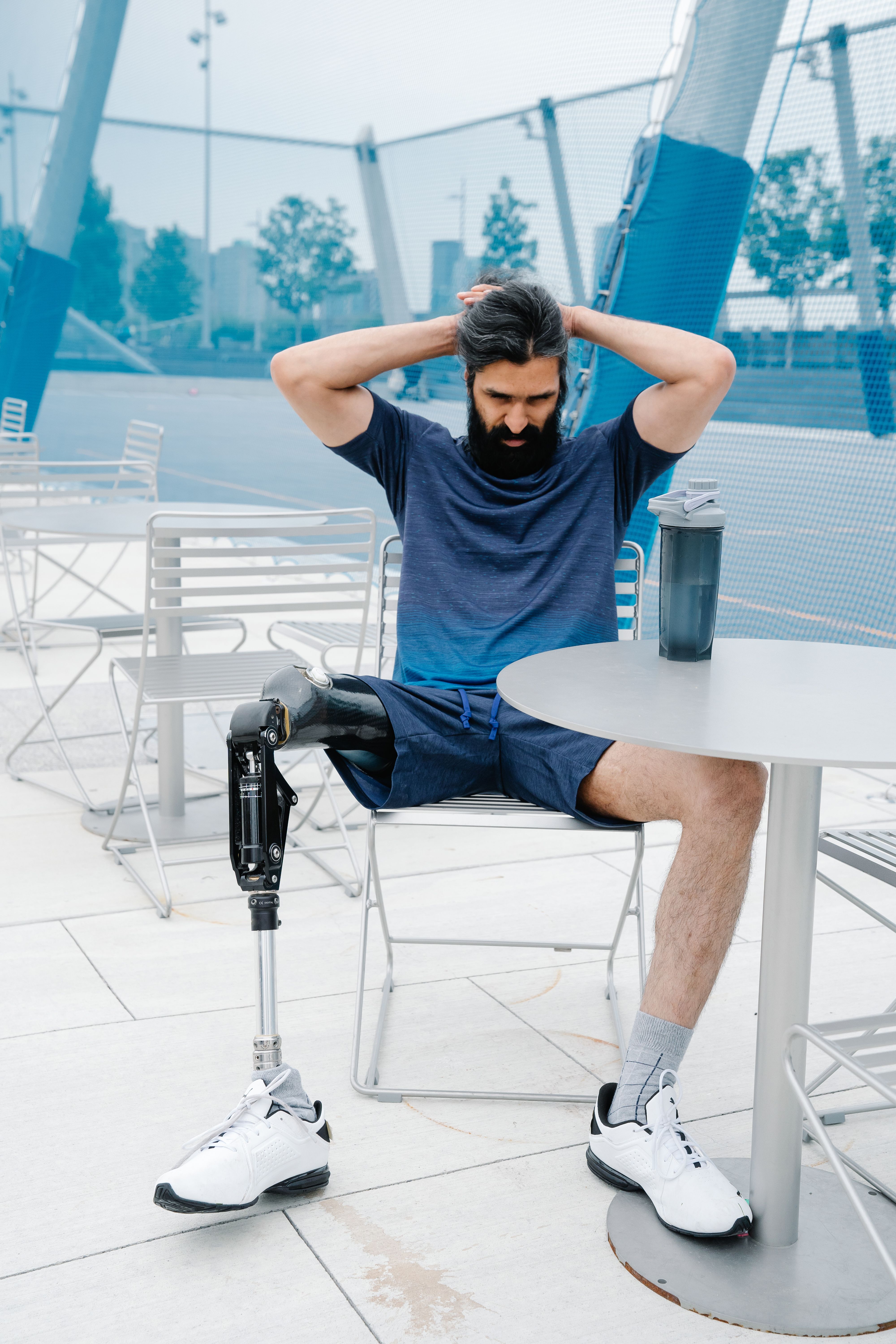 Man with Prosthetic Limb sitting on Chair · Free Stock Photo