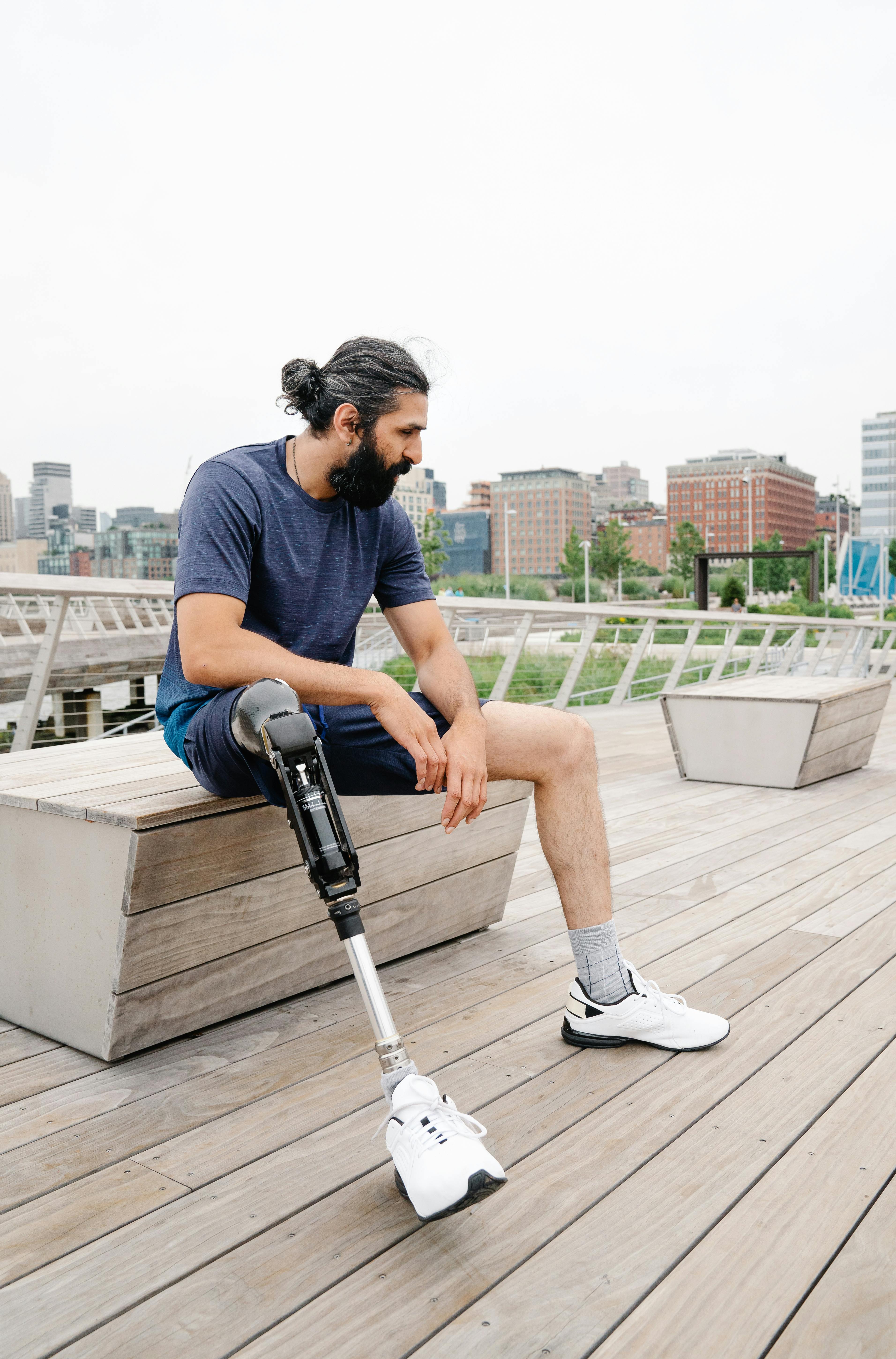 Man Putting On Prosthetic Leg · Free Stock Photo