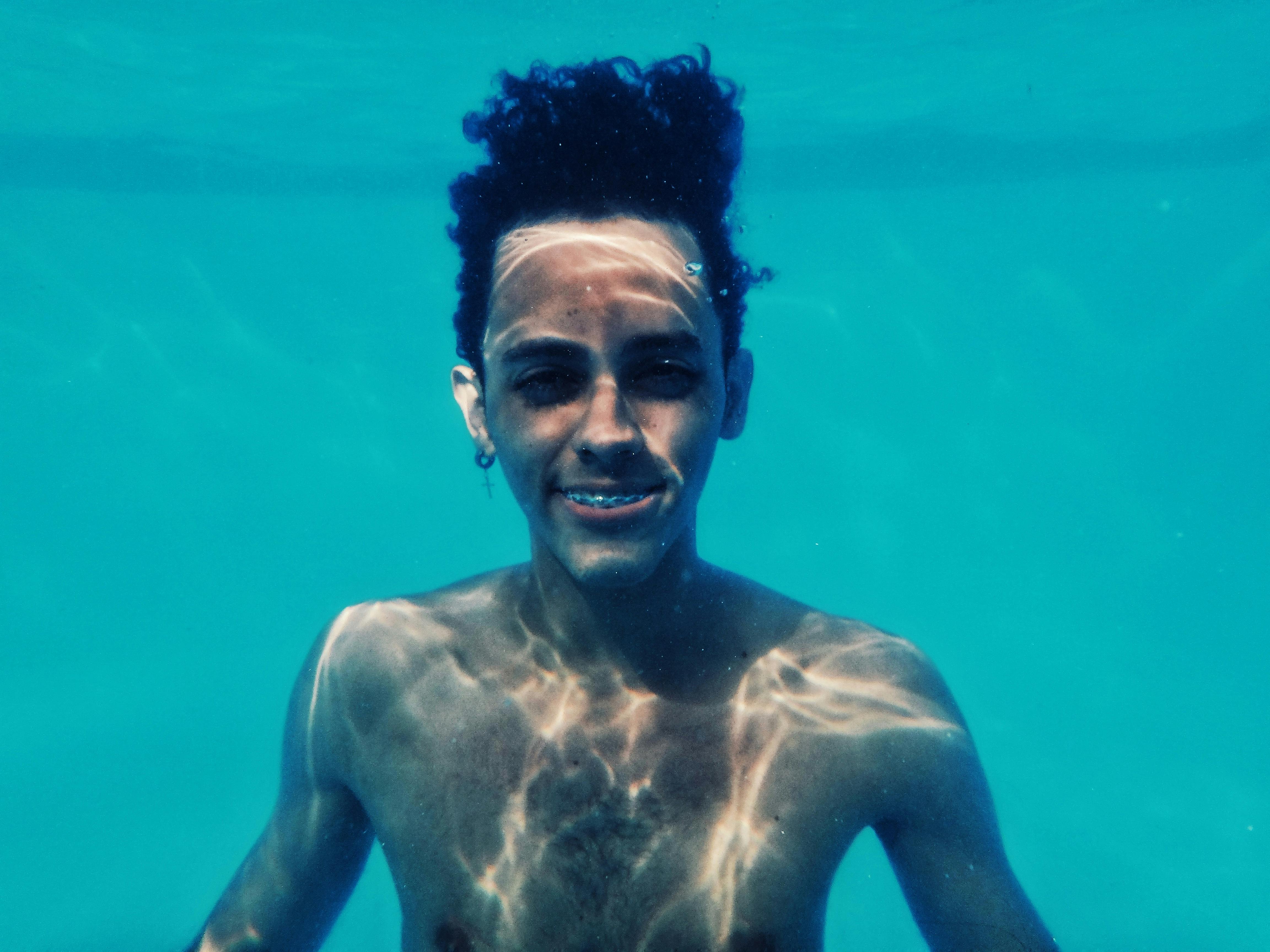 A Man Smiling Underwater · Free Stock Photo