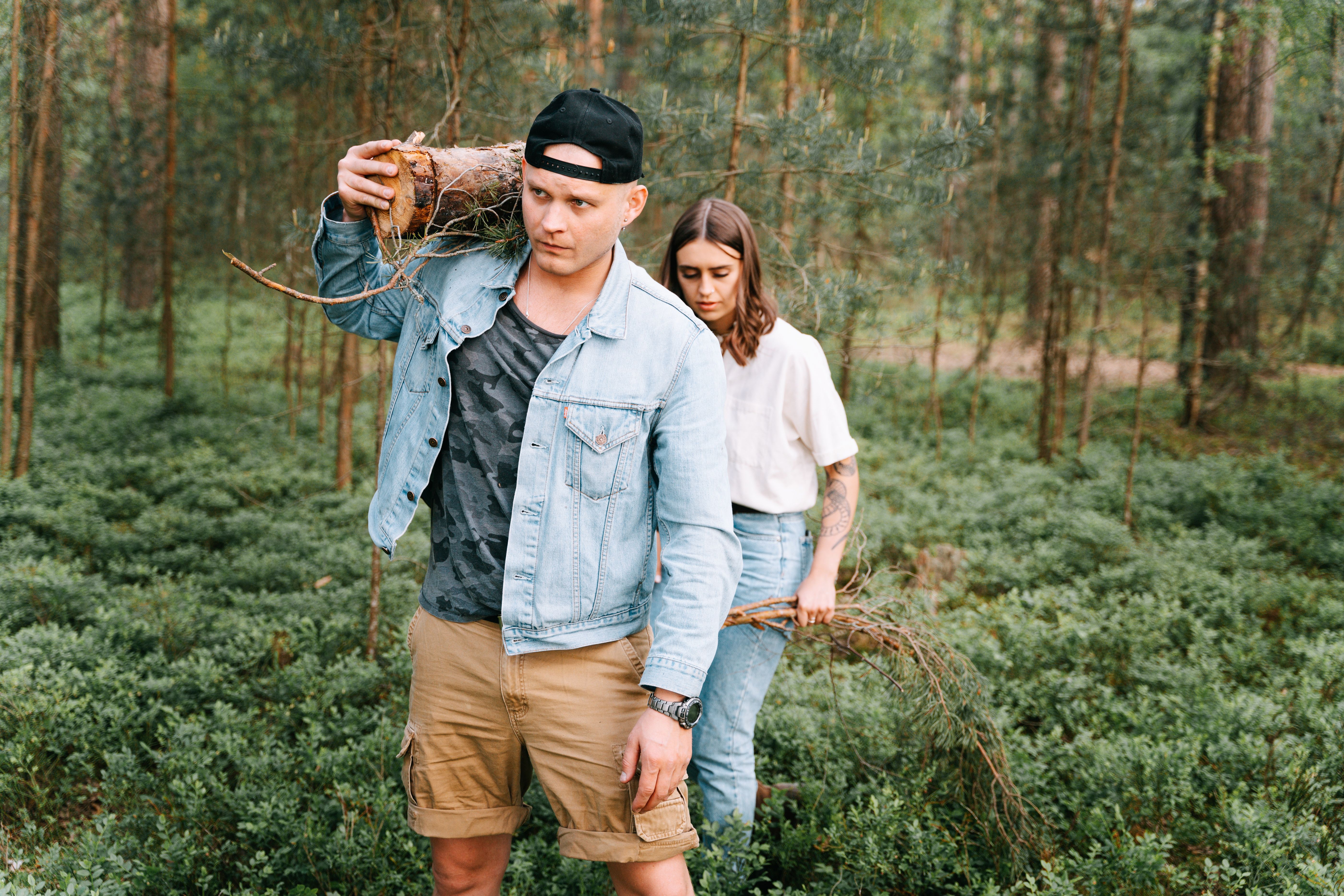 A Couple Gathering Wood in the Forest · Free Stock Photo
