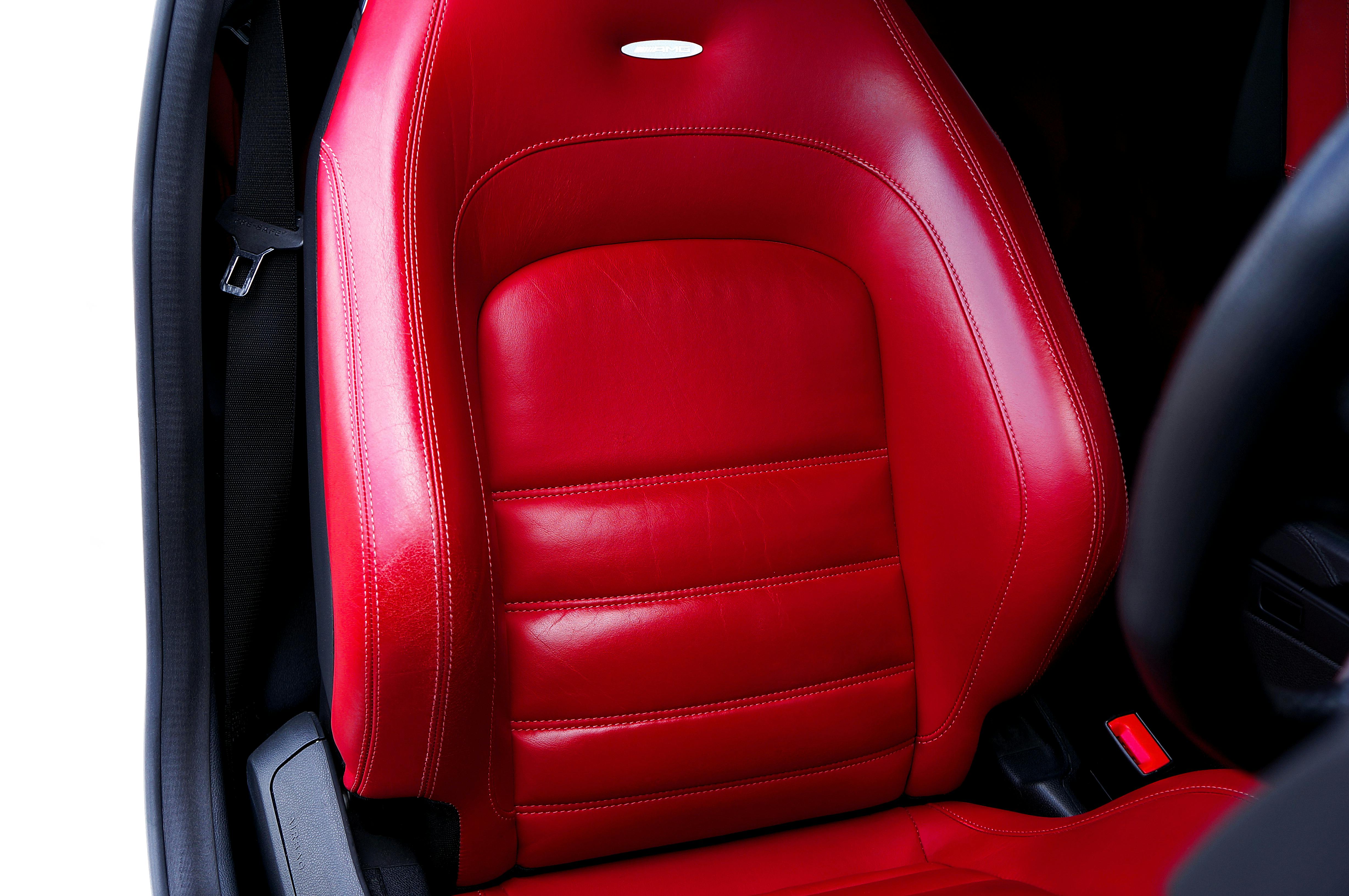 Close-Up Shot of a Red Leather Car Seat · Free Stock Photo