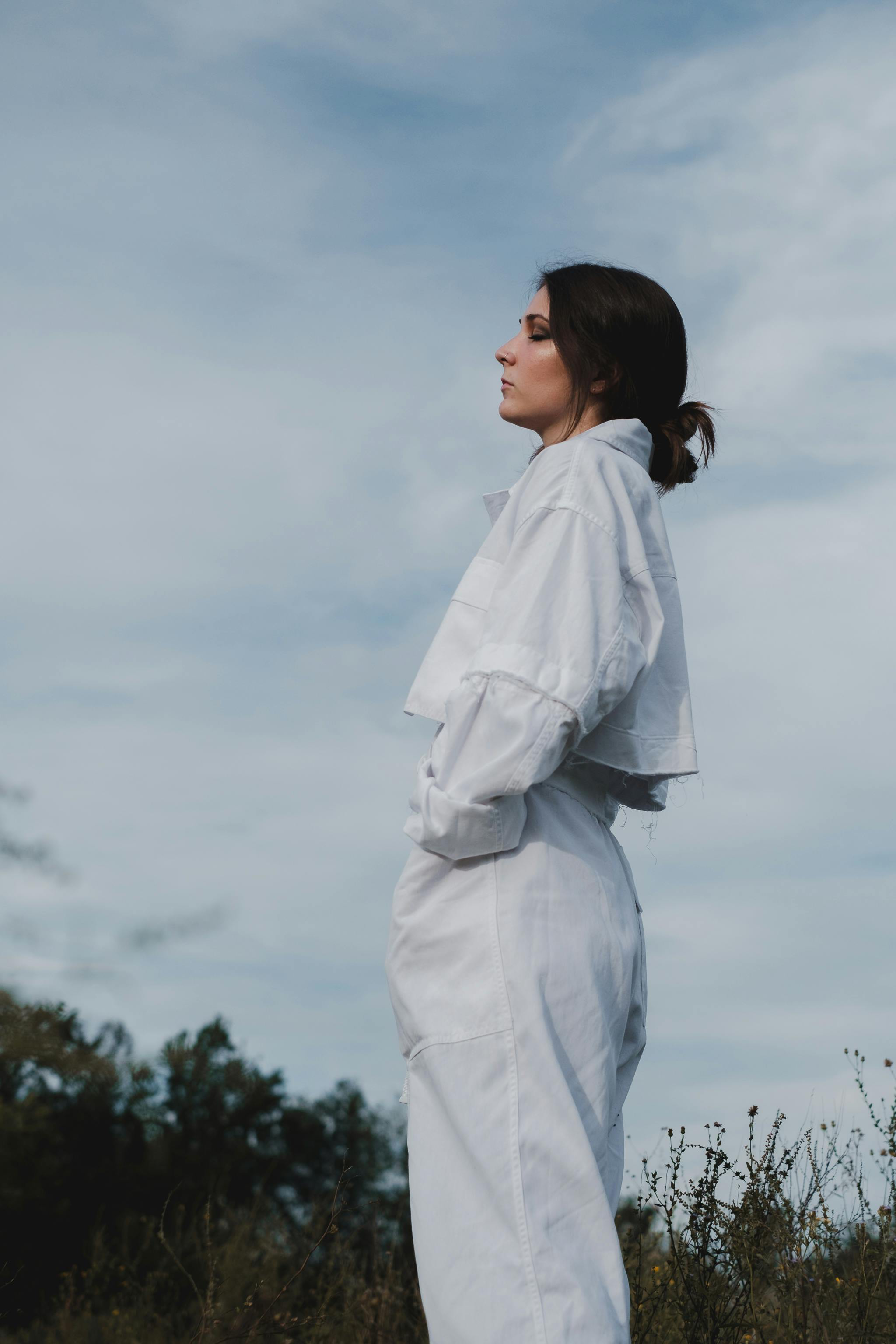 Side View of a Woman Wearing White Clothes · Free Stock Photo