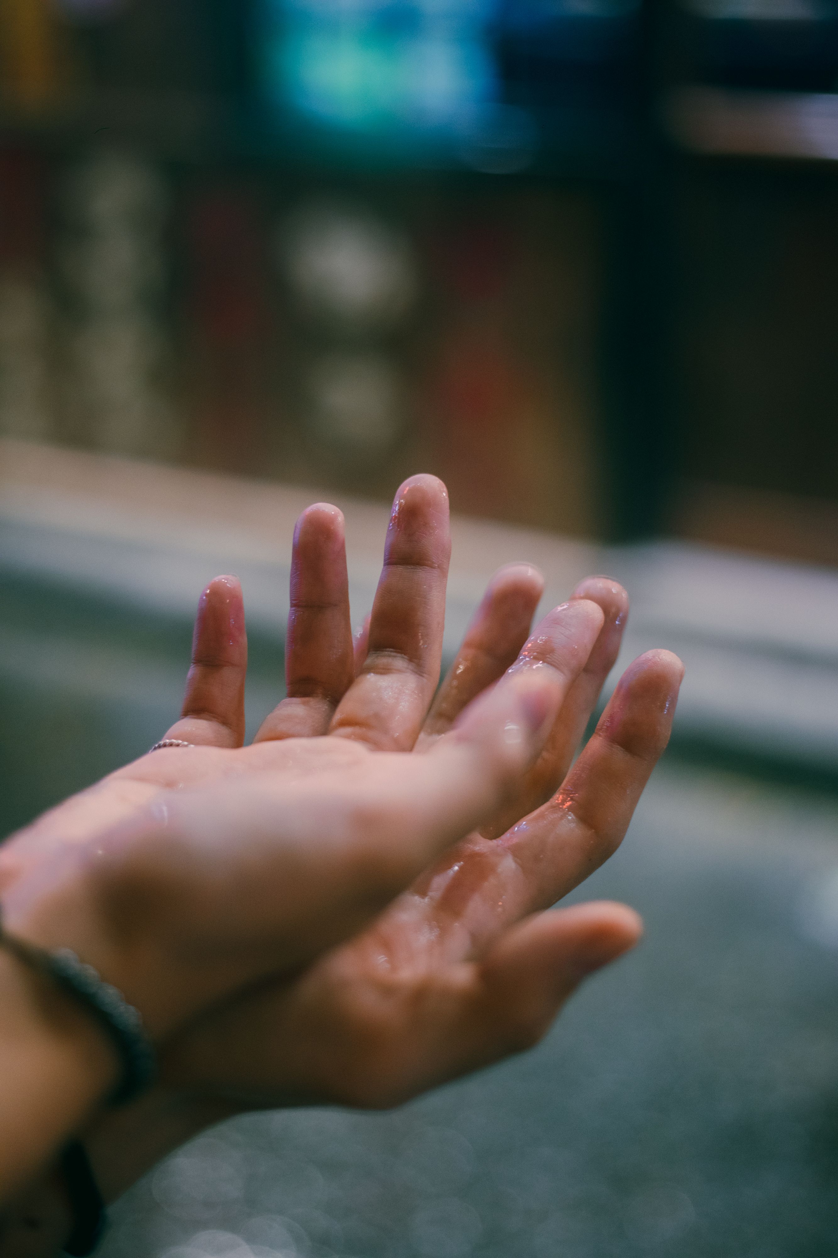Wet Person's Hands in Close Up Photography · Free Stock Photo