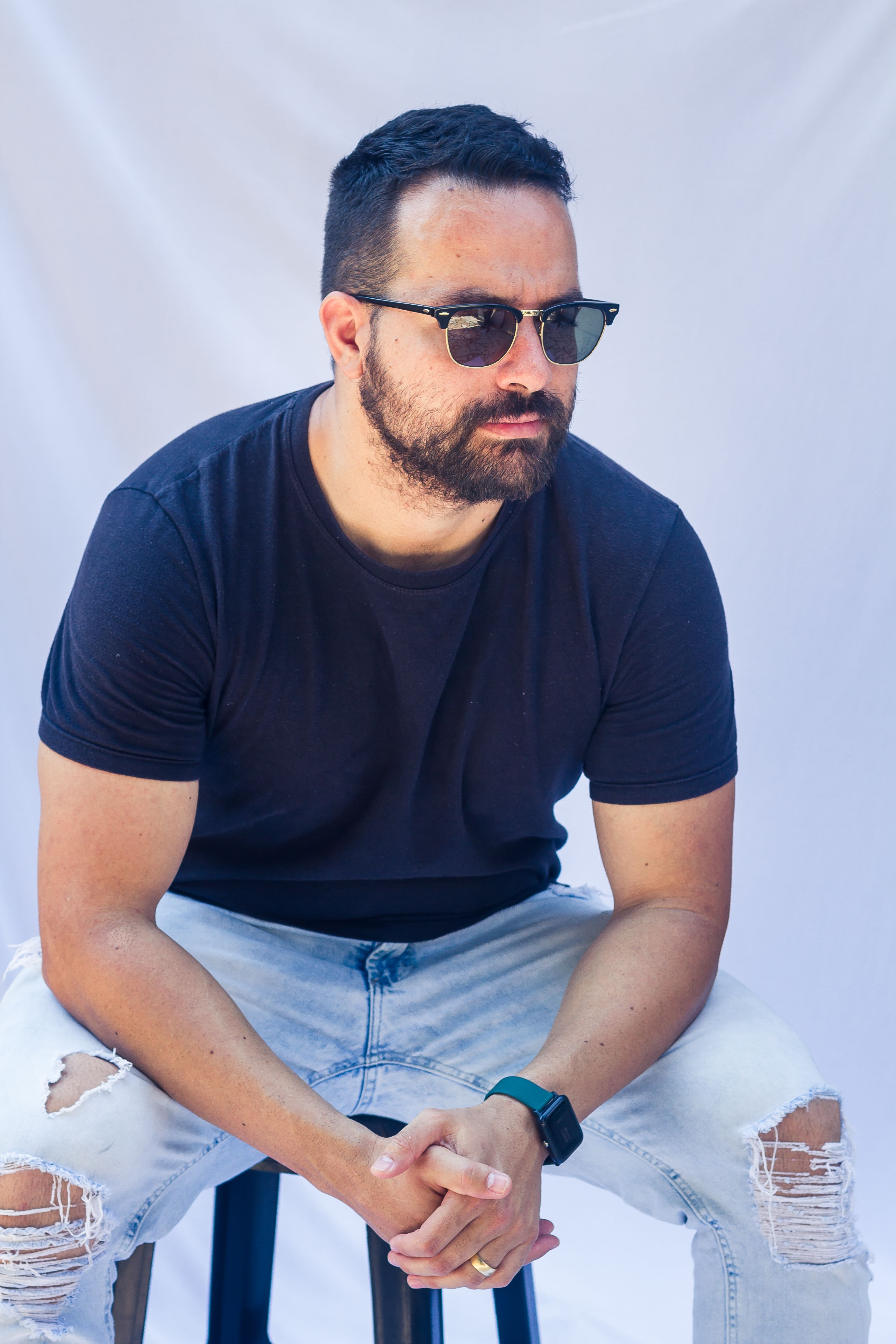 A Man Wearing Shades with a Red Light · Free Stock Photo