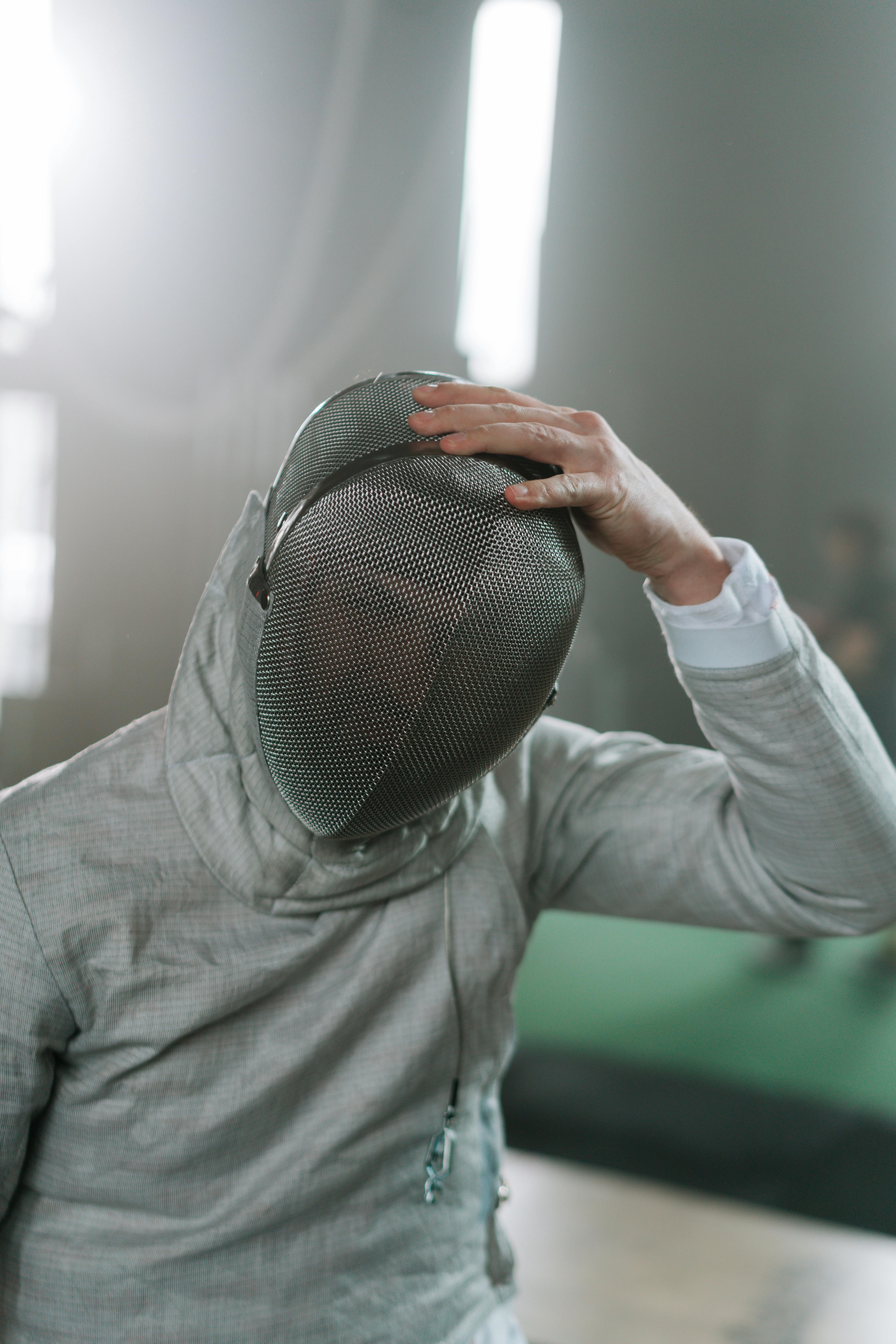 Person in fencing mask · Free Stock Photo