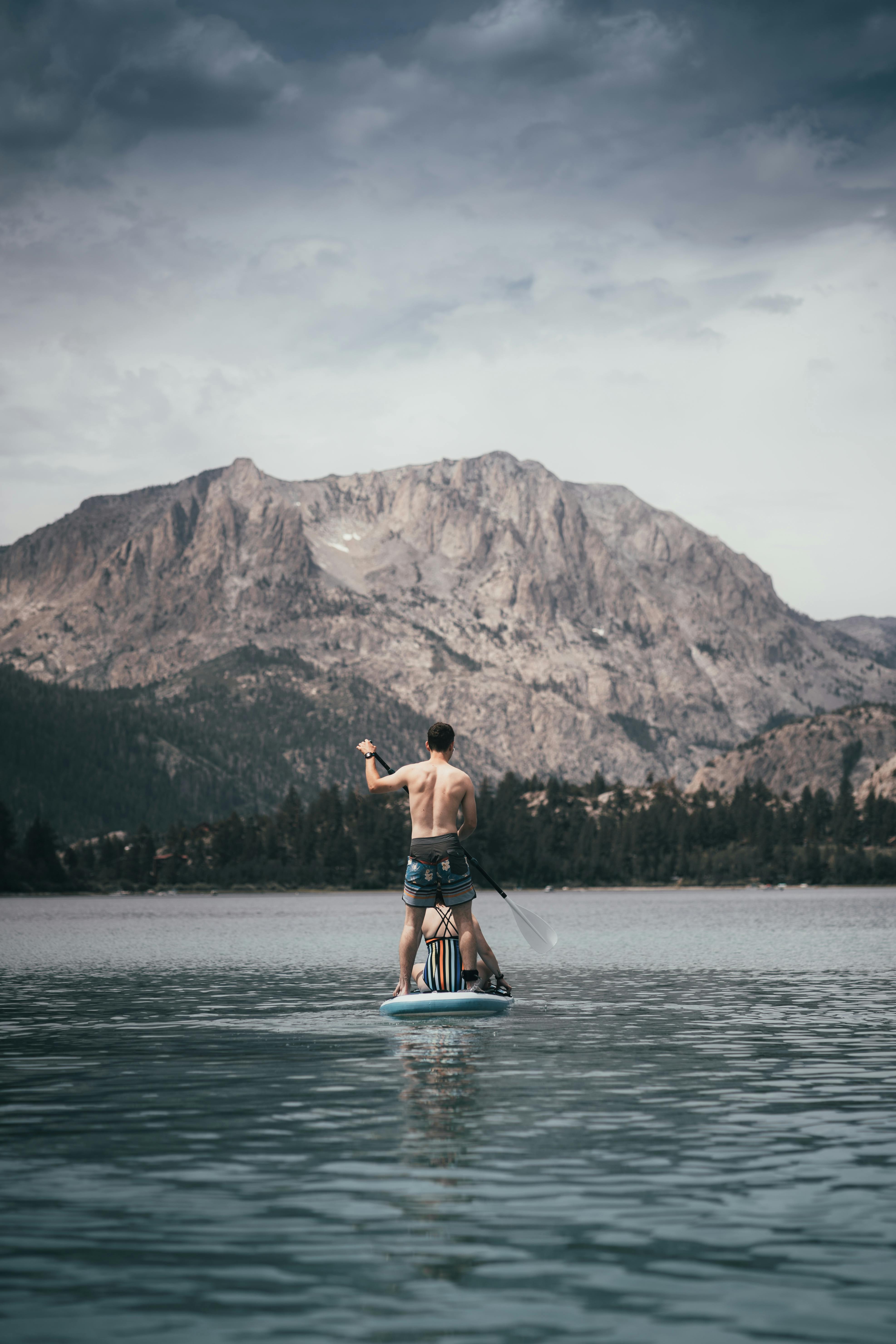 Person Riding a Paddleboard on Sea · Free Stock Photo