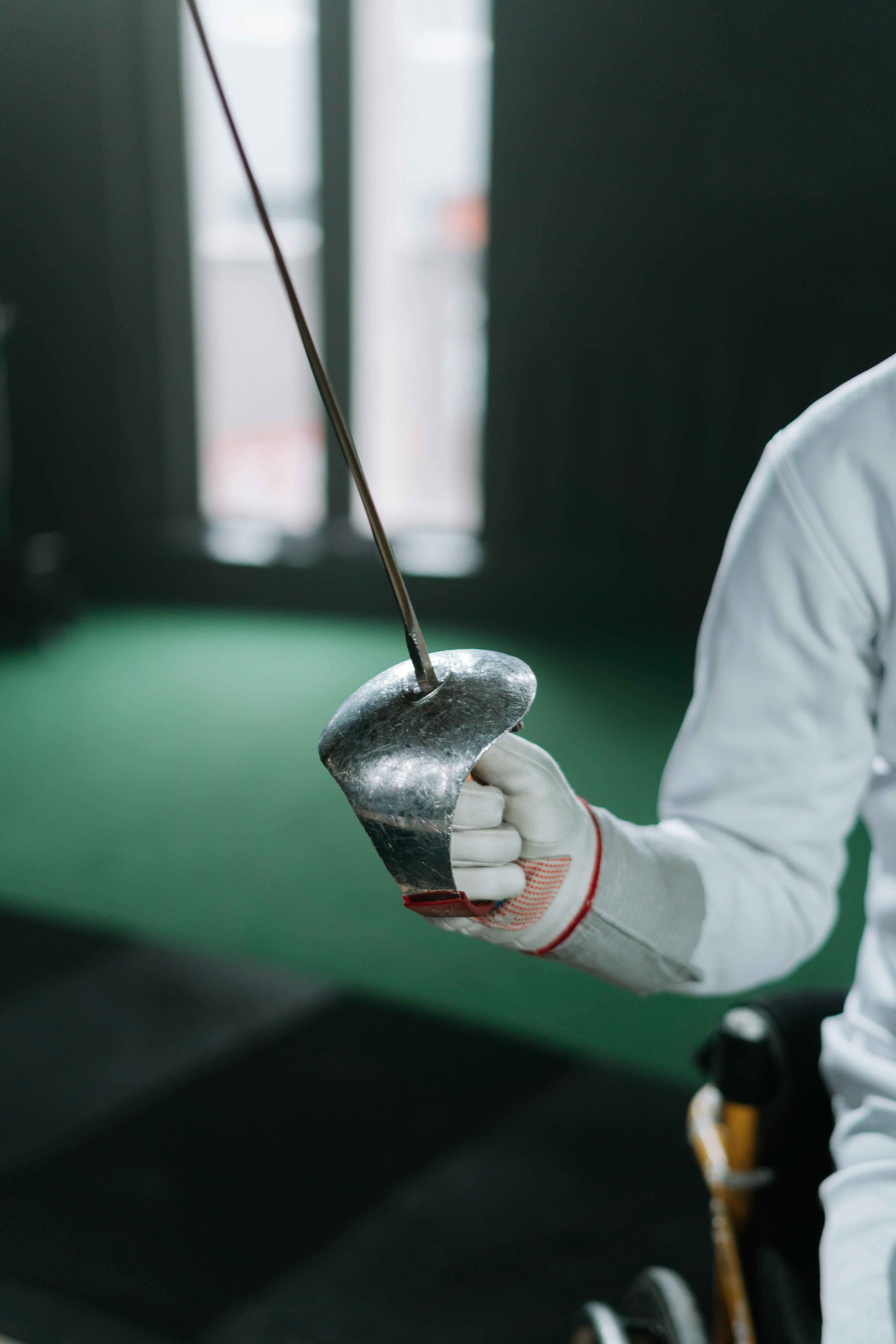 Close-up of two men fencing · Free Stock Photo