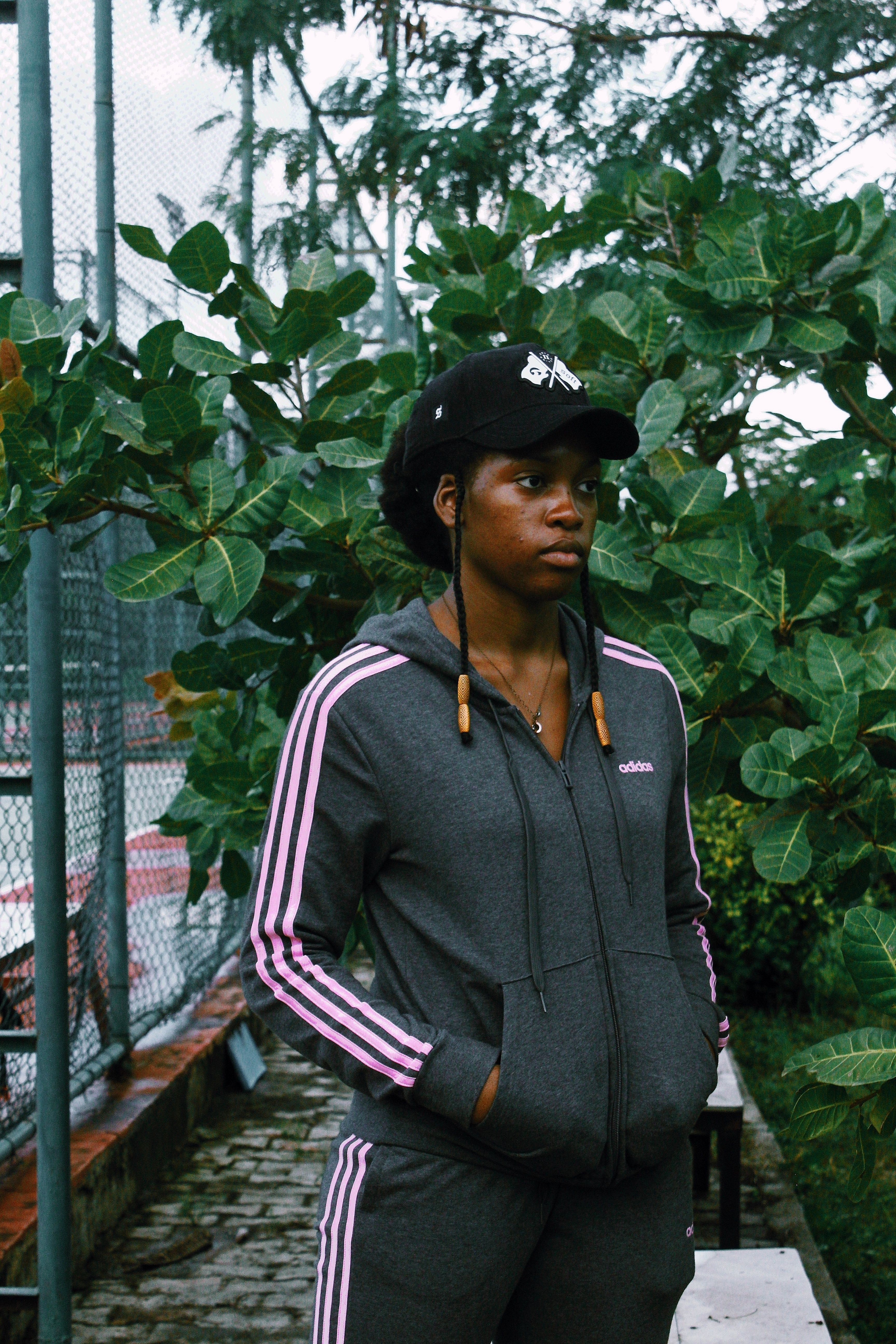 Woman Wearing Tracksuit in Front of a Field · Free Stock Photo