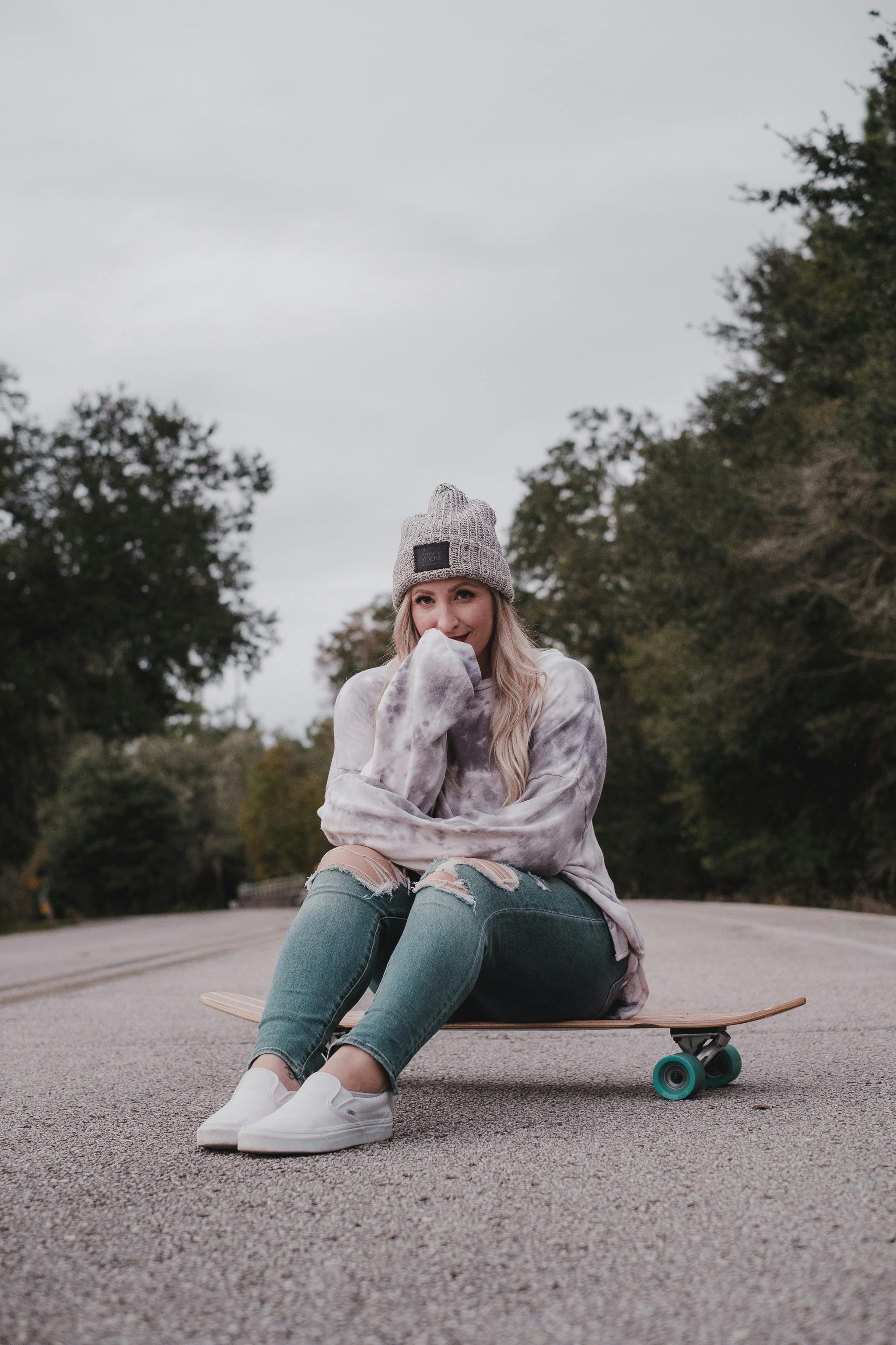 Photo of a Woman Longboarding · Free Stock Photo