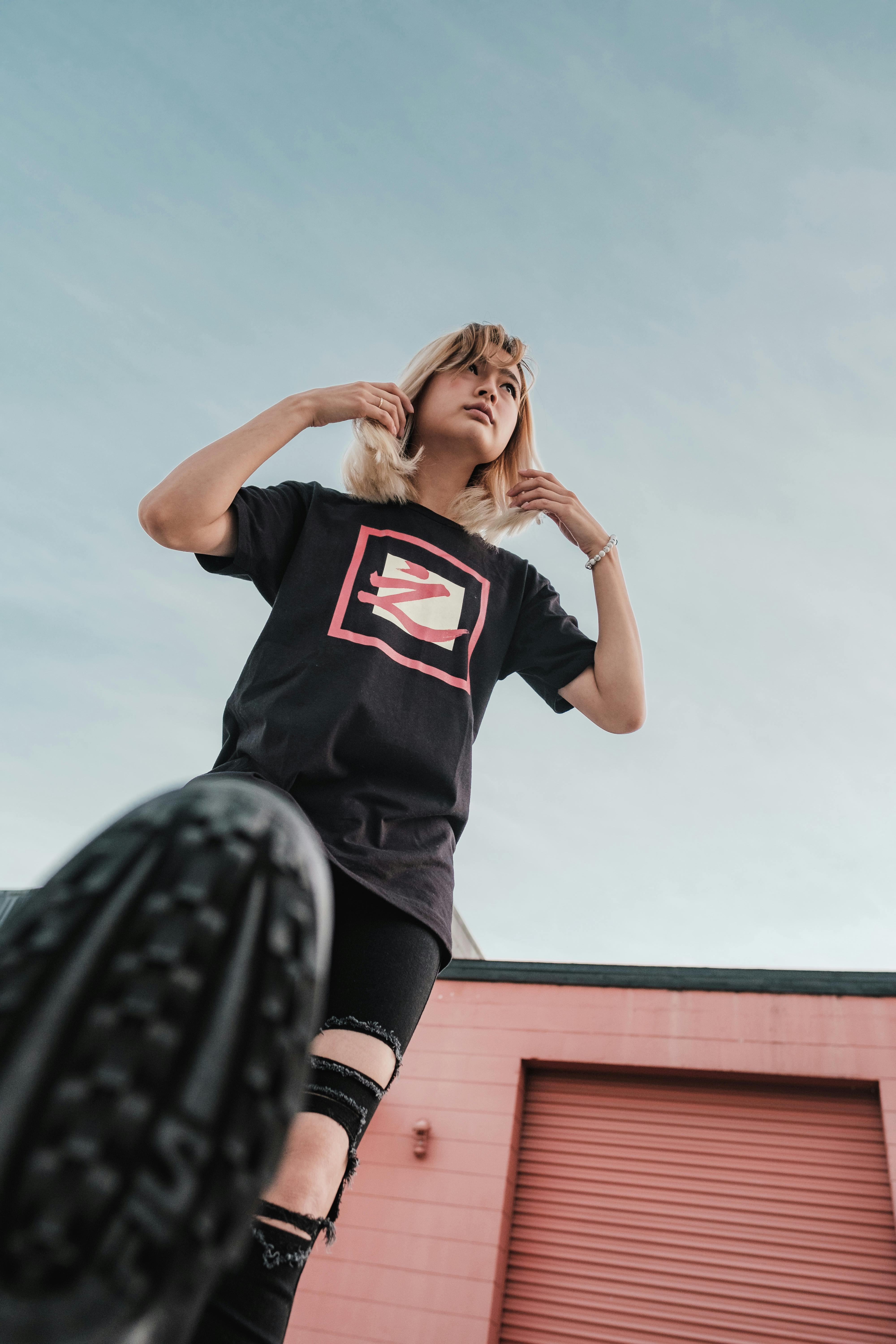 Low Angle Photo of Woman Looking to Her Right · Free Stock Photo