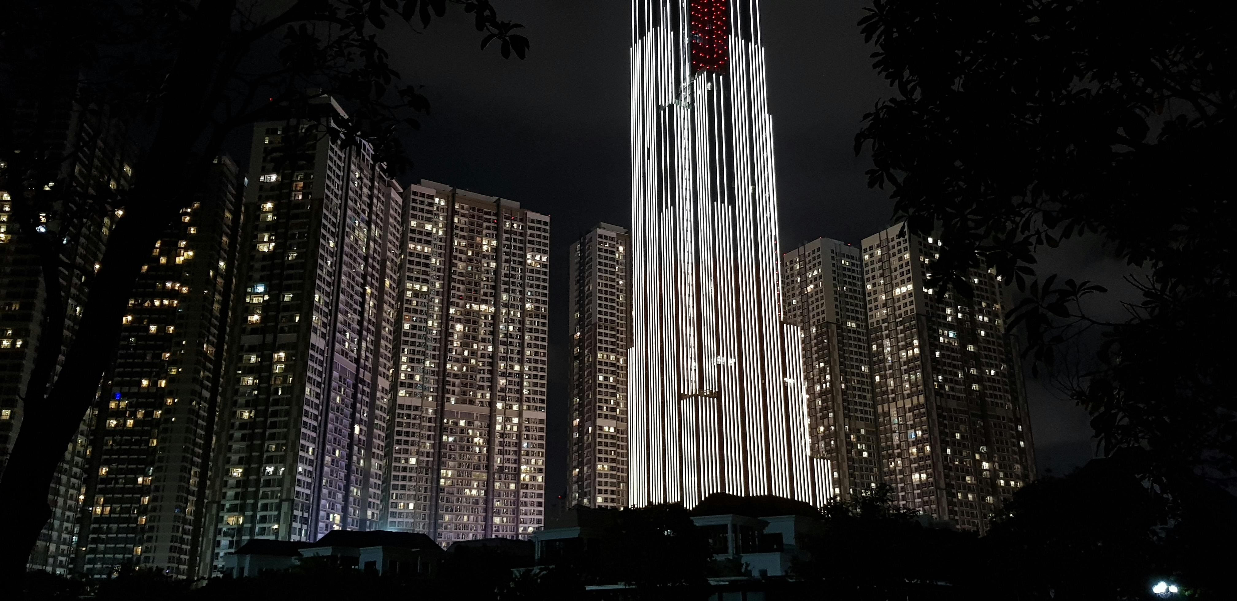 Person Holding Black Dslr Camera Taking Photo of City Lights during ...