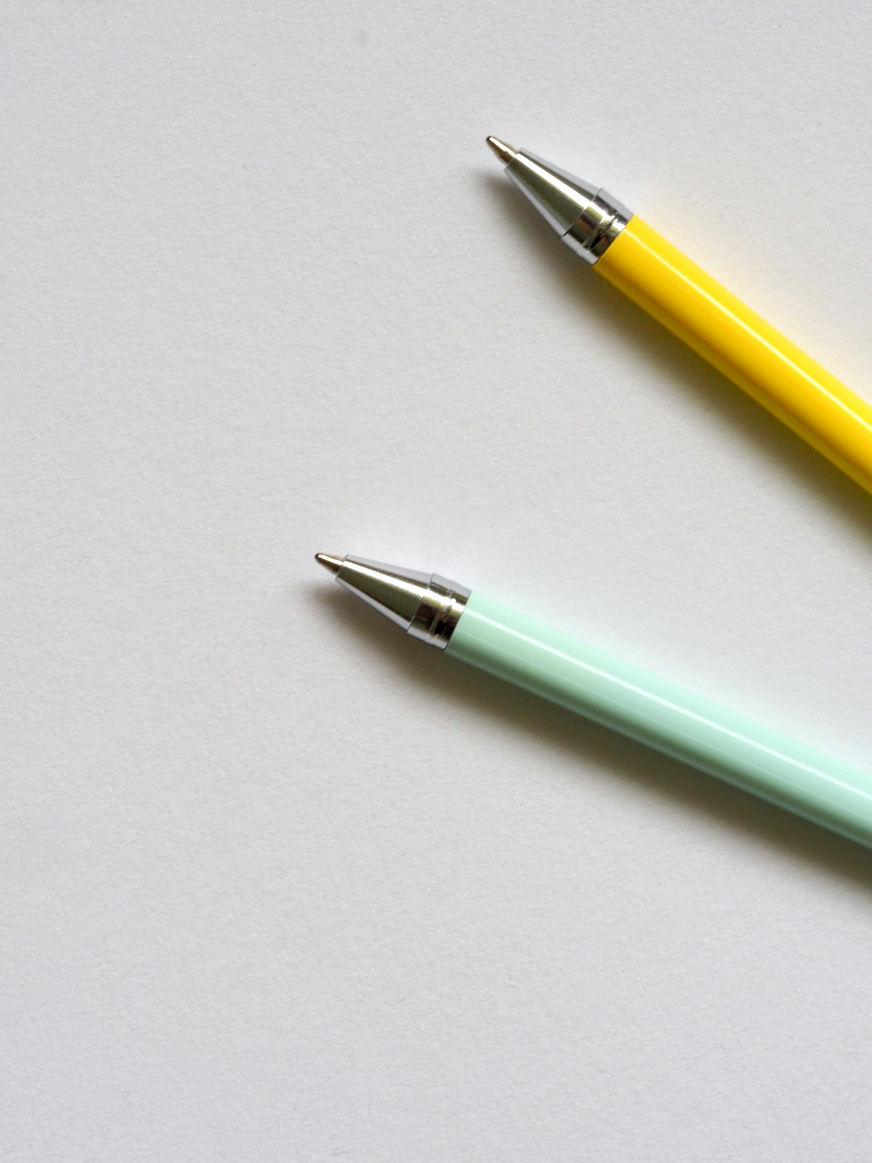 Photo of Teal and Yellow Point Pens · Free Stock Photo