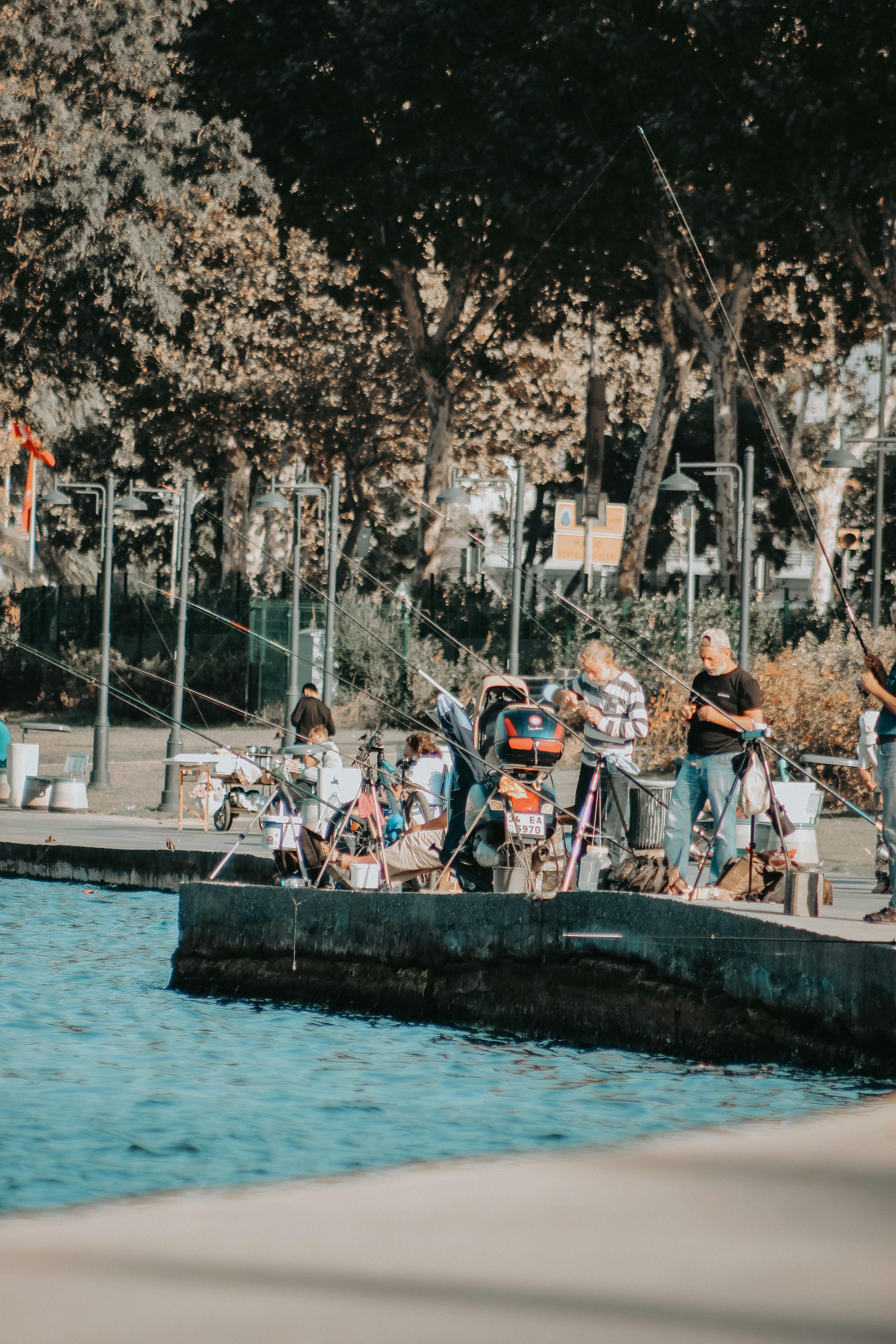 A Group of People Fishing on the Ocean · Free Stock Photo