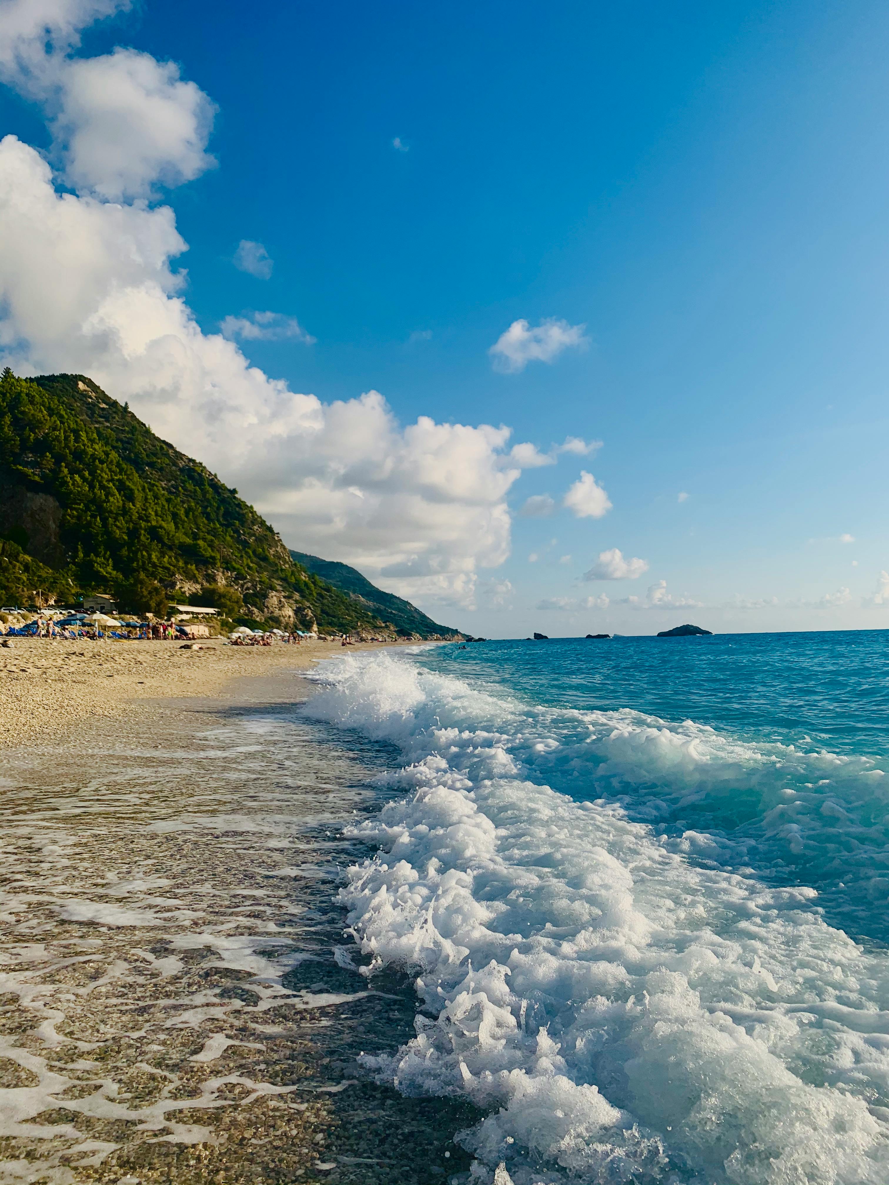Ocean Waves Under Blue Sky · Free Stock Photo