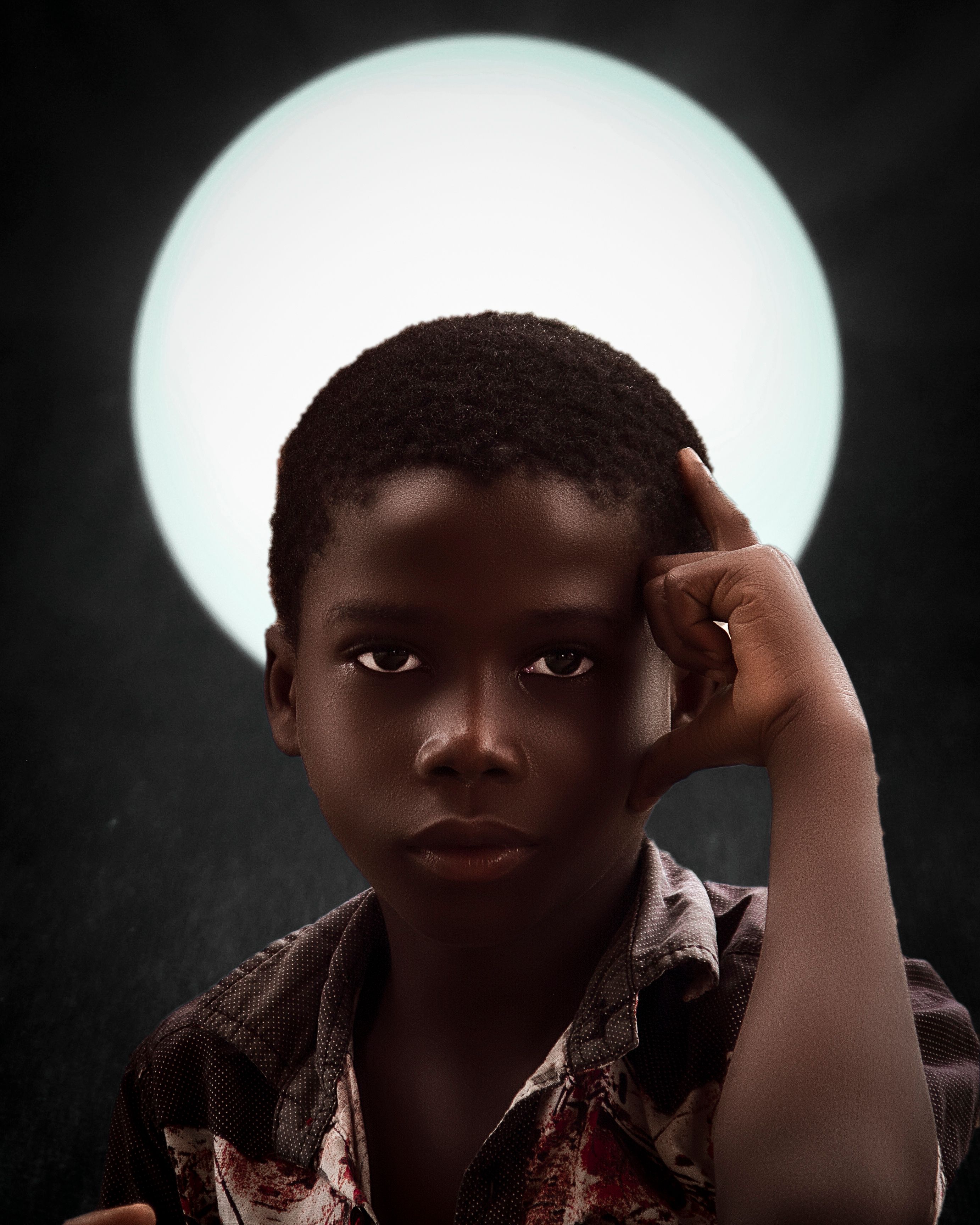 Portrait of a Boy with a Serious Face · Free Stock Photo