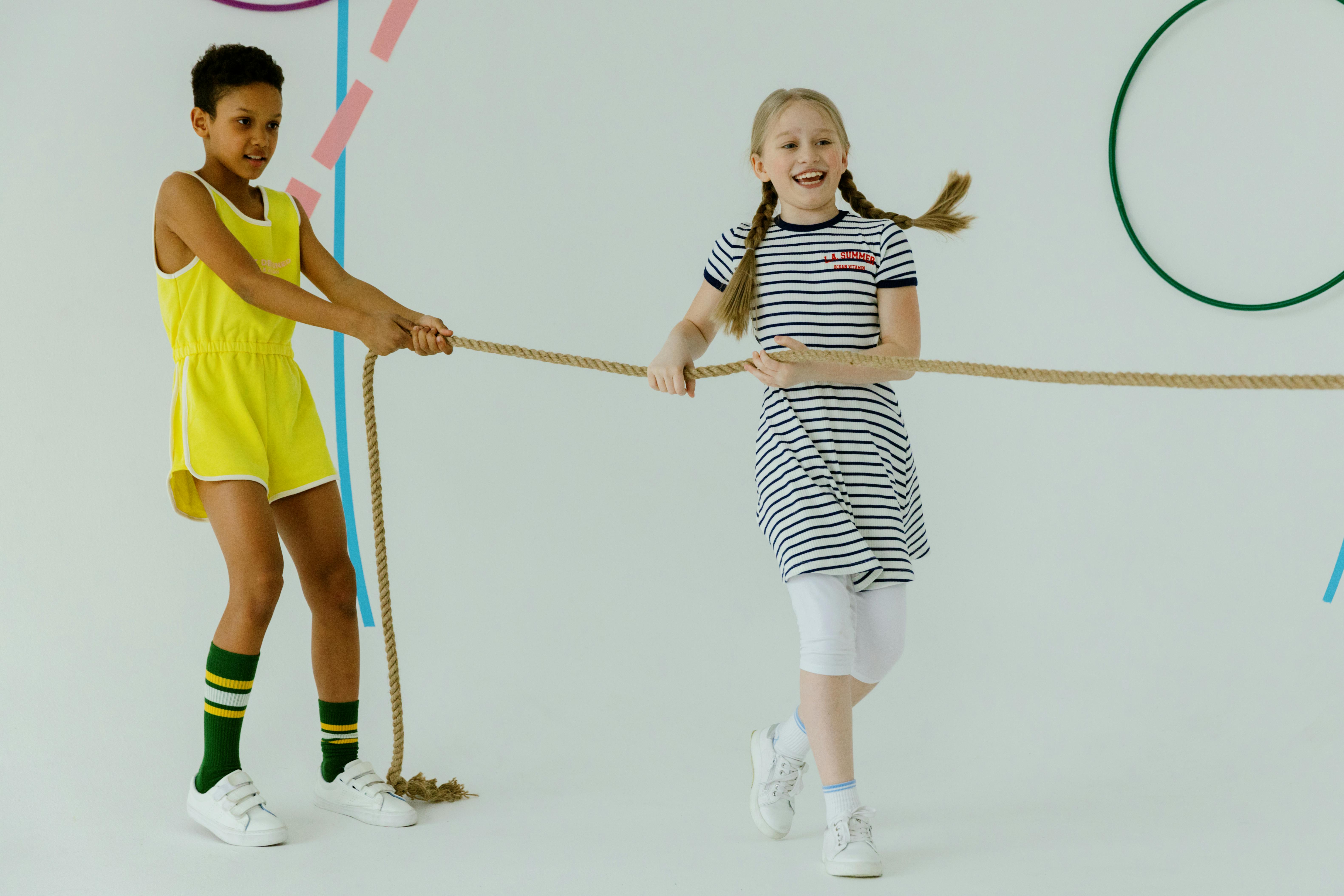 Girls Holding on a Rope · Free Stock Photo