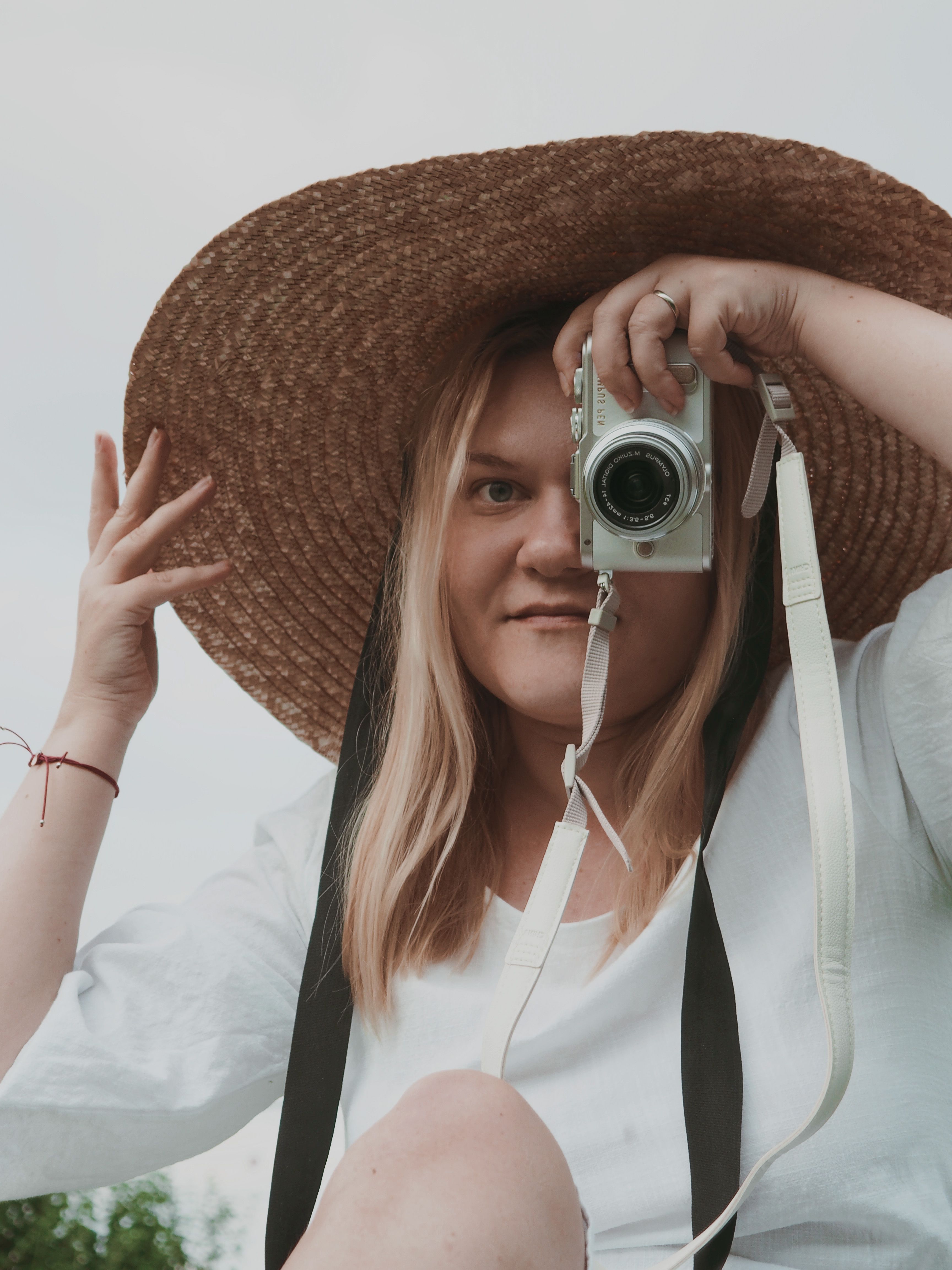 Woman Taking Pictures with a Camera · Free Stock Photo