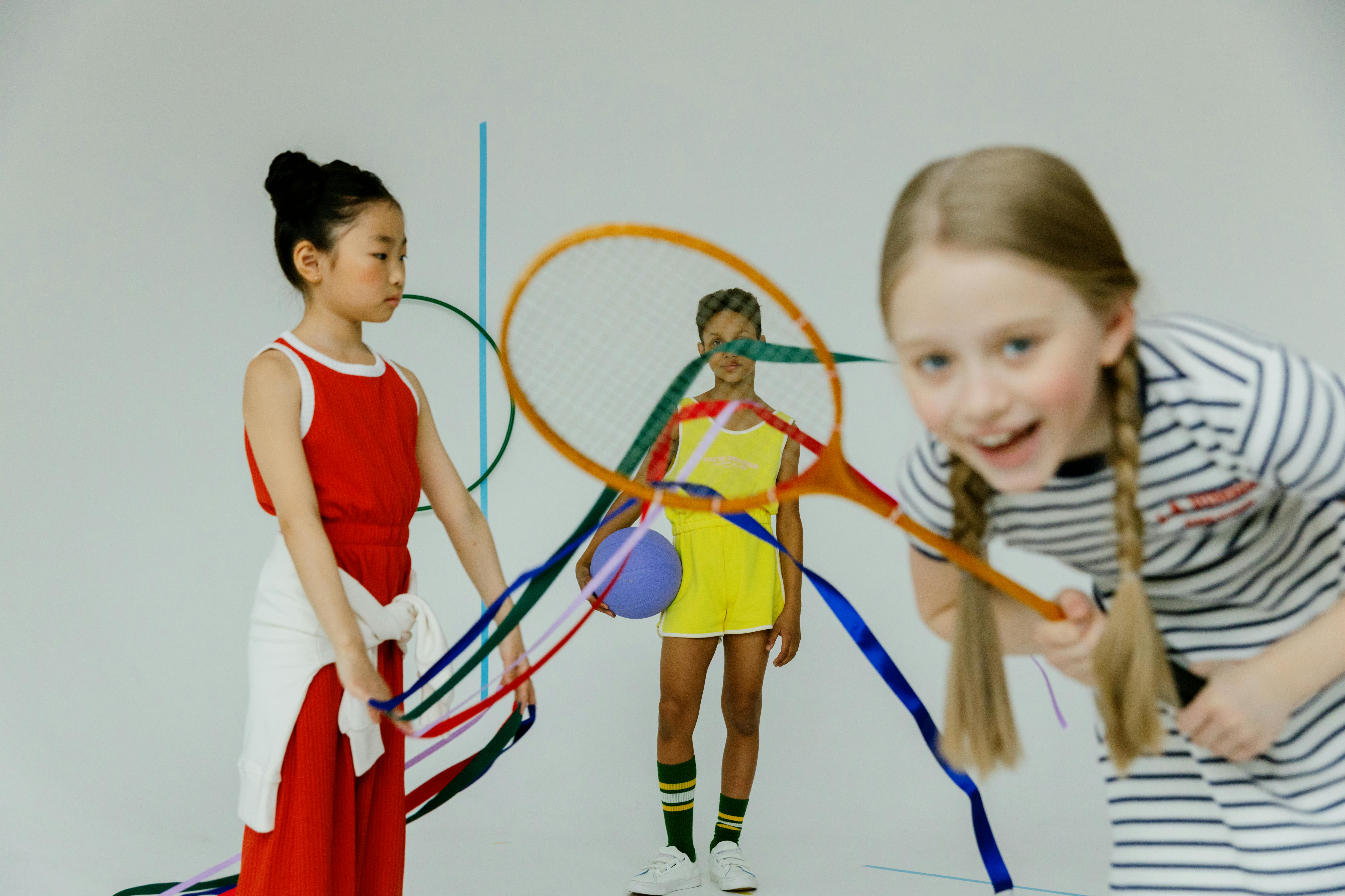 Girls in Sportswear Having Fun Playing with Colorful Balls · Free Stock ...