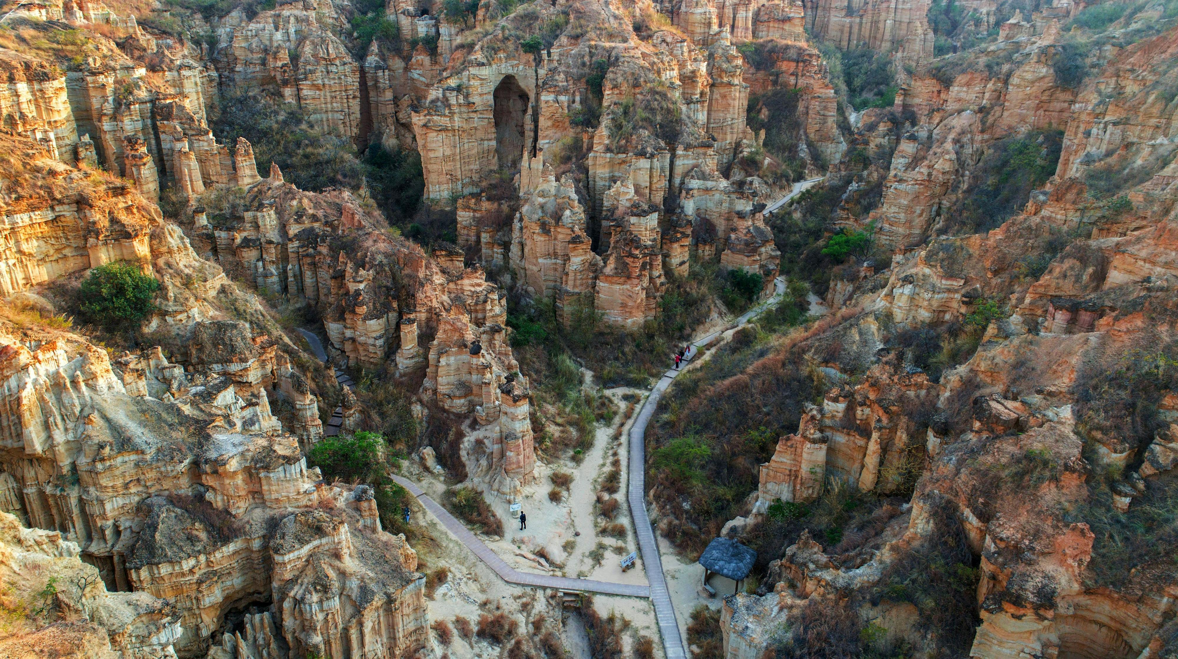 Road Between Rock Formations · Free Stock Photo