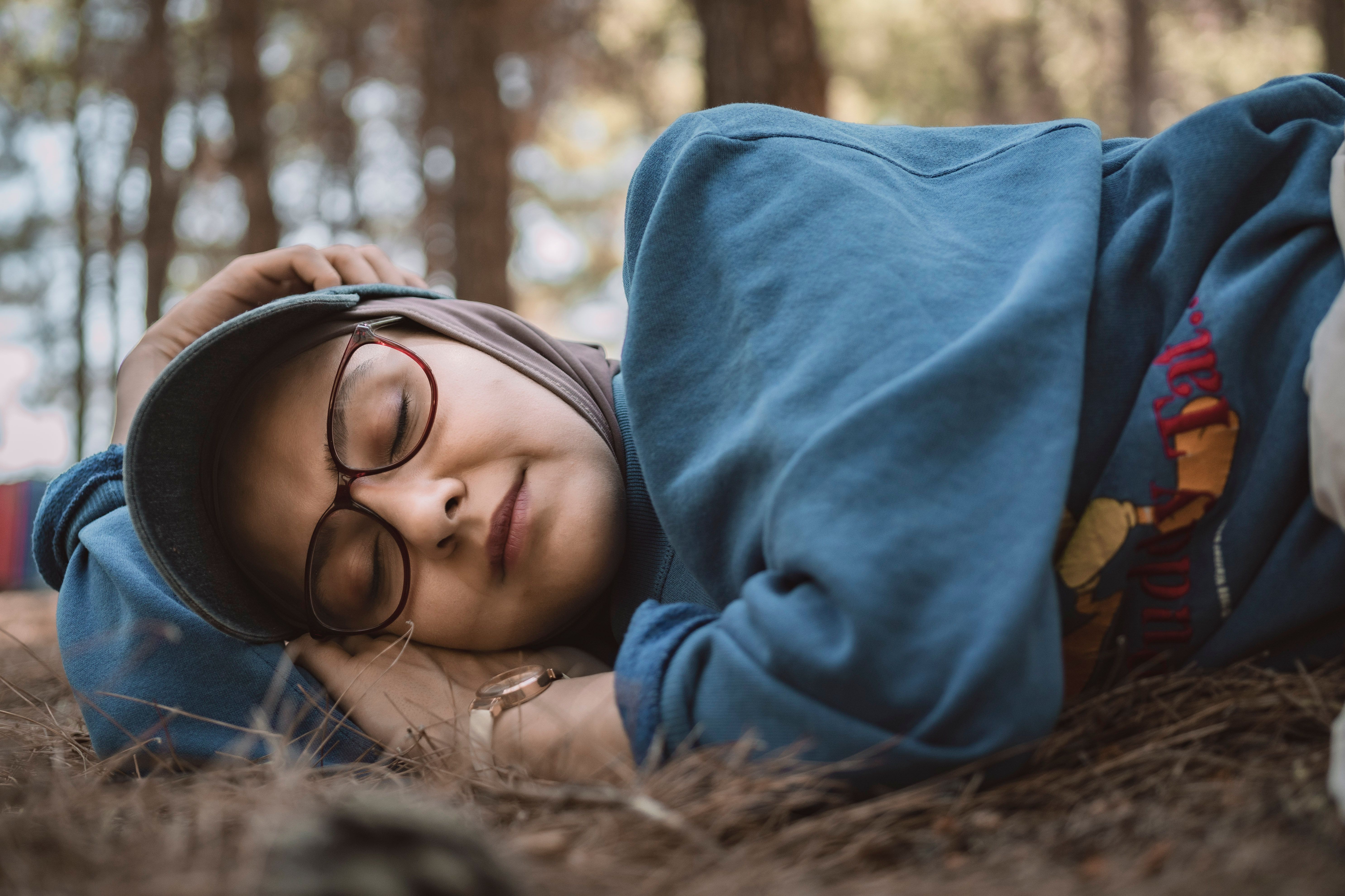 A Woman Lying on the Ground · Free Stock Photo