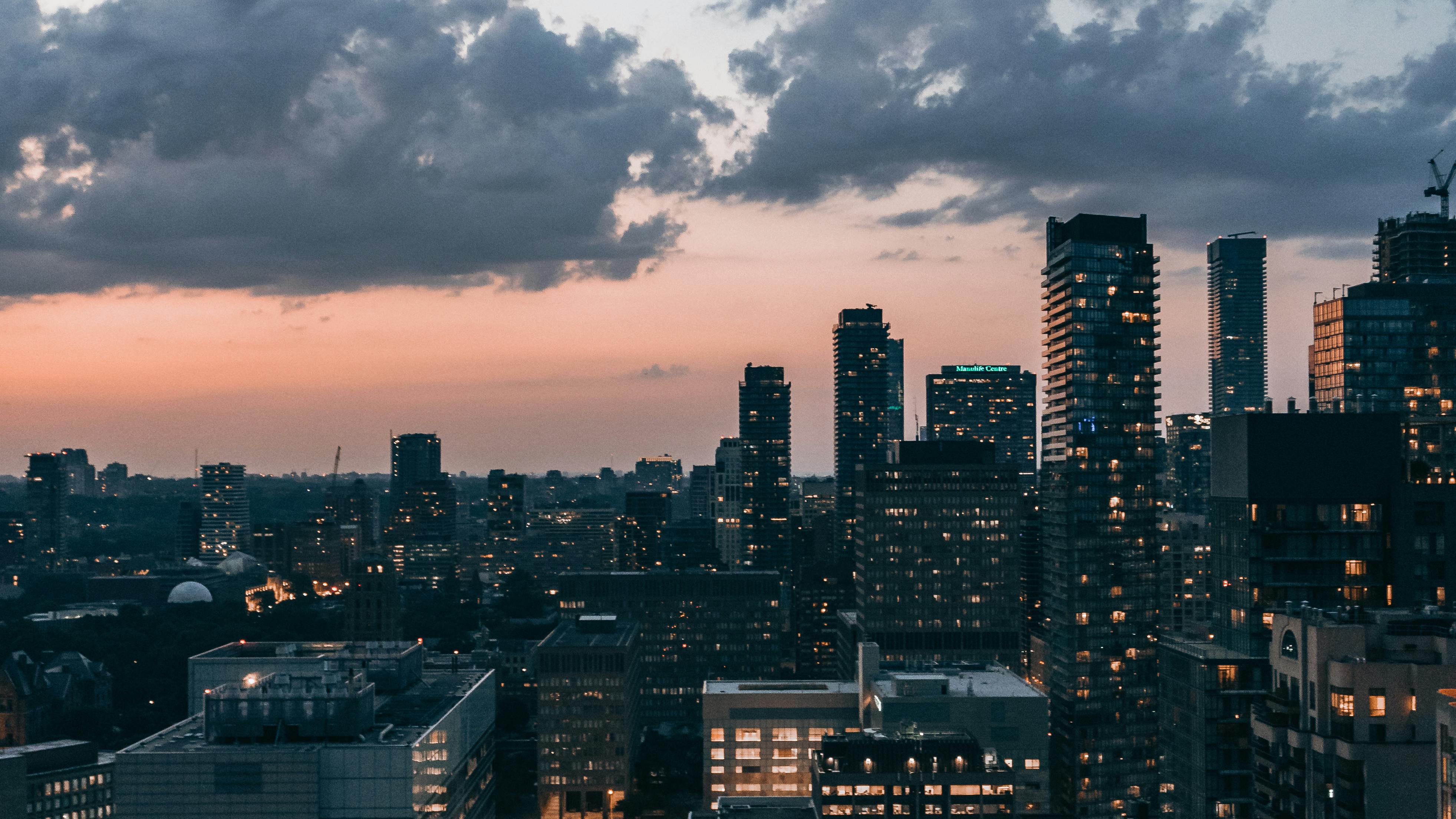 Aerial View of City Skyline Under Gray Clouds · Free Stock Photo