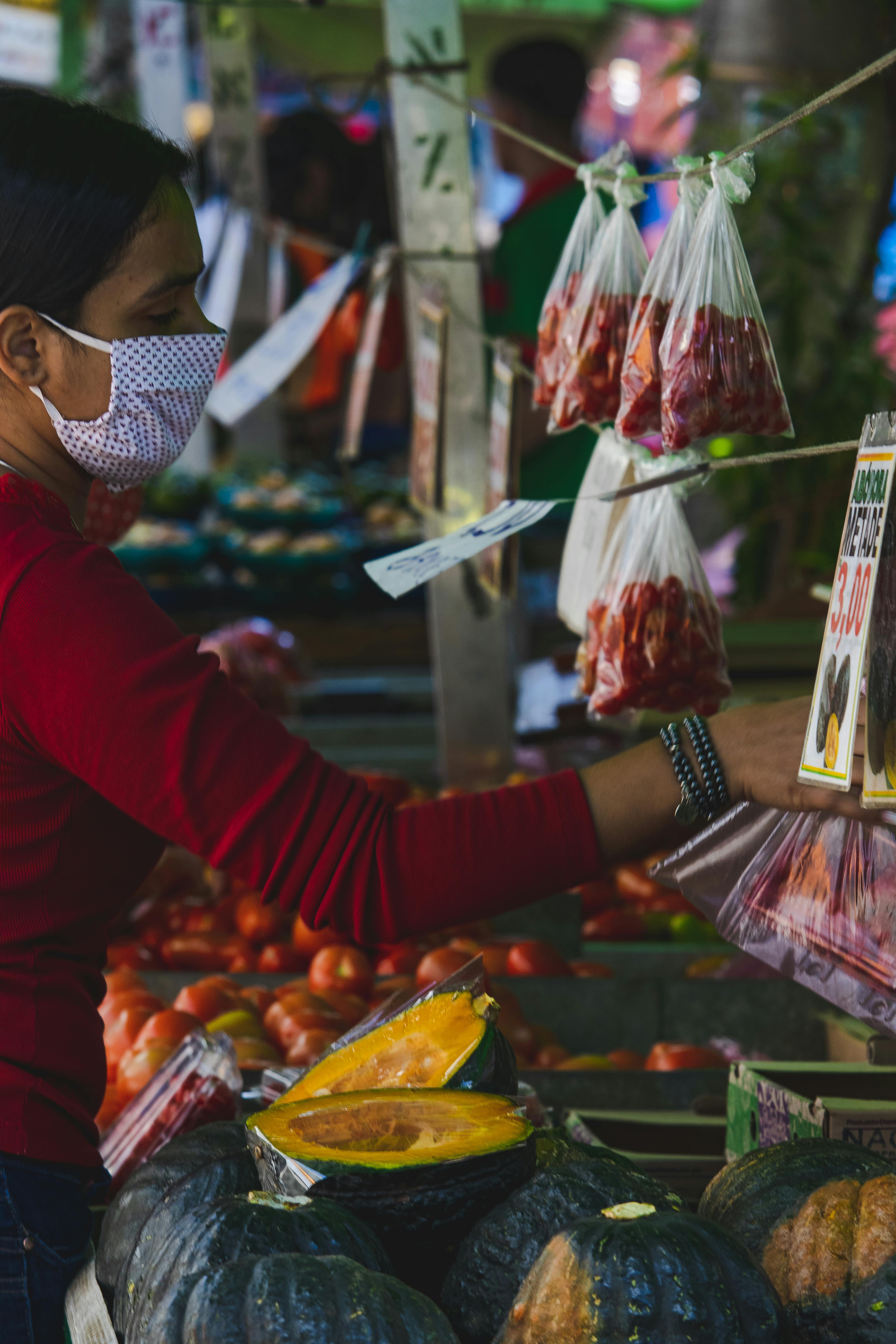 A Woman Purchasing Food in the Market · Free Stock Photo