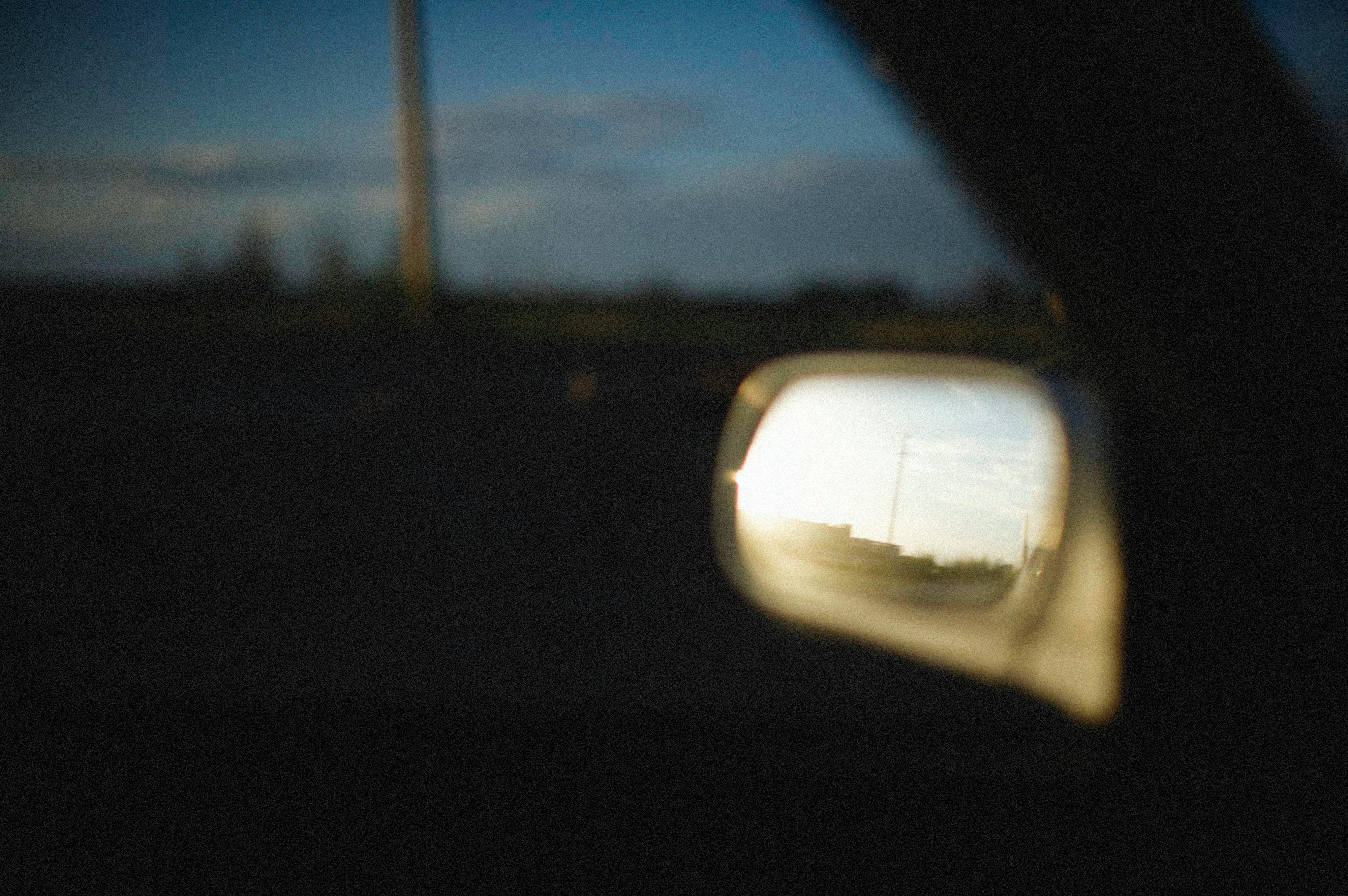 Reflection in Car Mirror · Free Stock Photo
