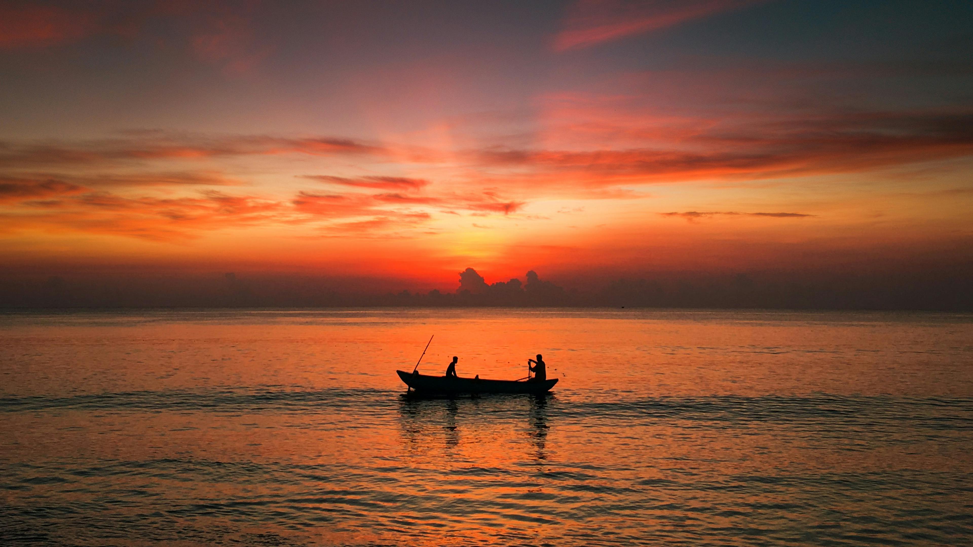 A People in the Boat During Sunrise · Free Stock Photo