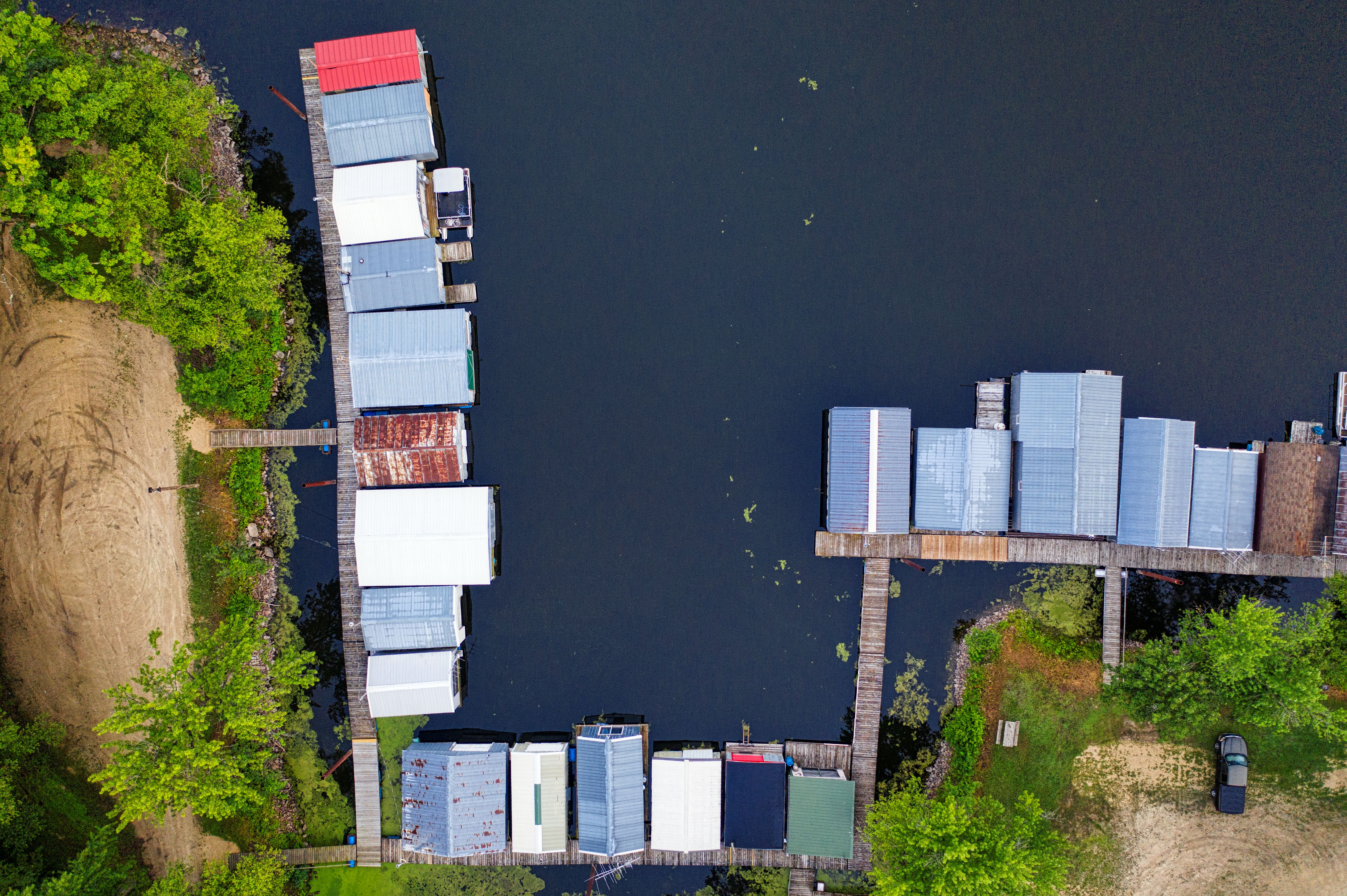 Roofs of Huts on Lakeshore · Free Stock Photo