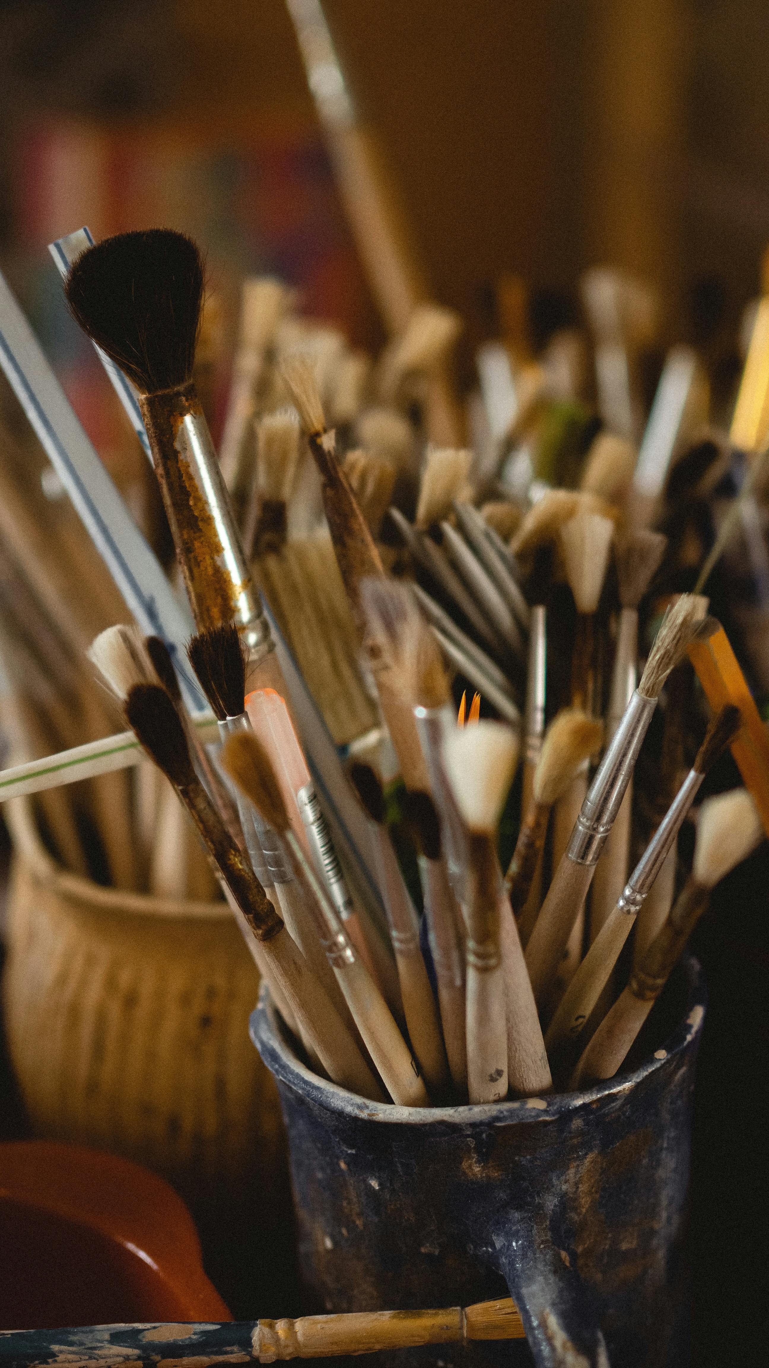 Close-Up Shot of Variety of Paintbrushes with Brown Paint · Free Stock ...