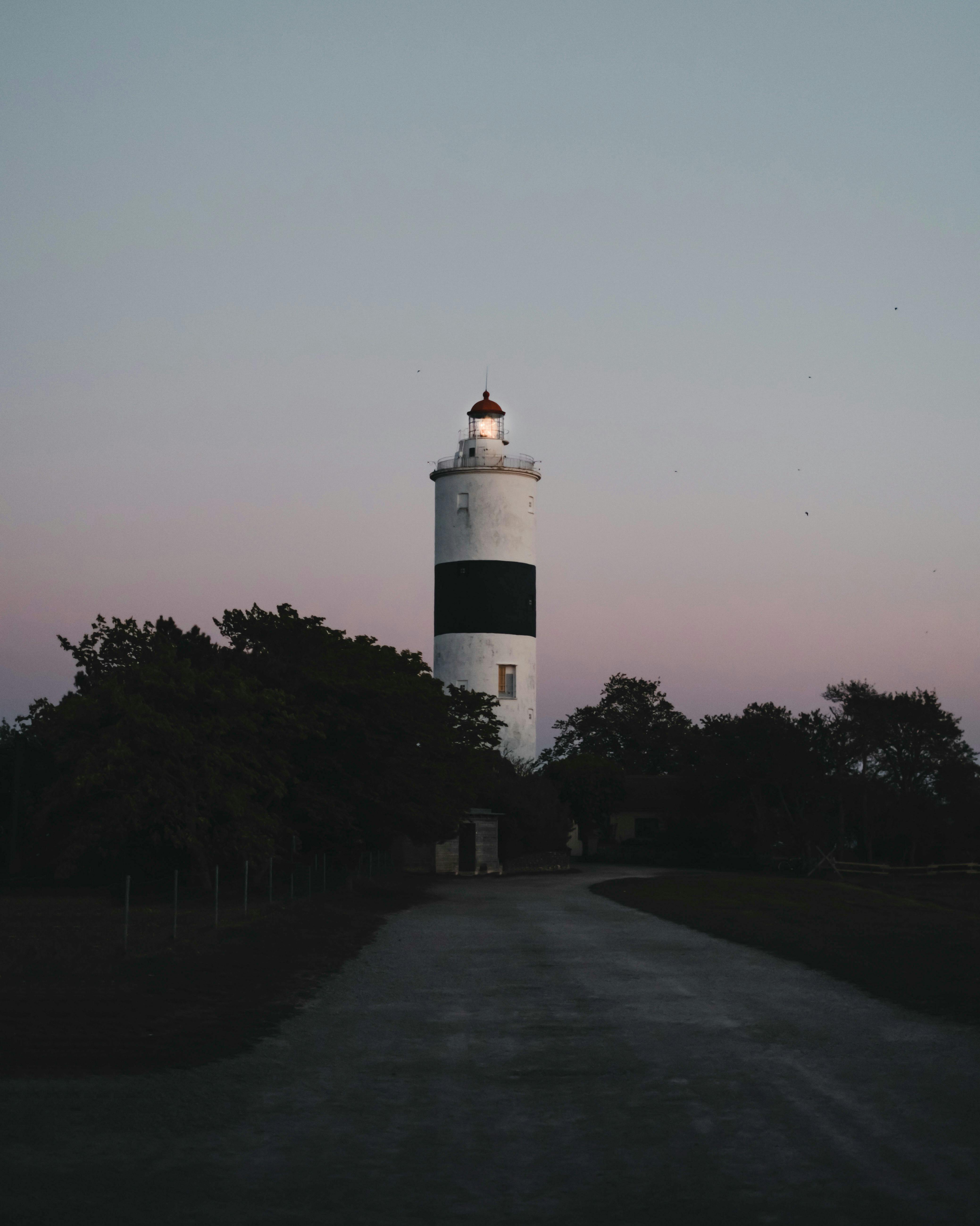 House with Lighthouse behind · Free Stock Photo